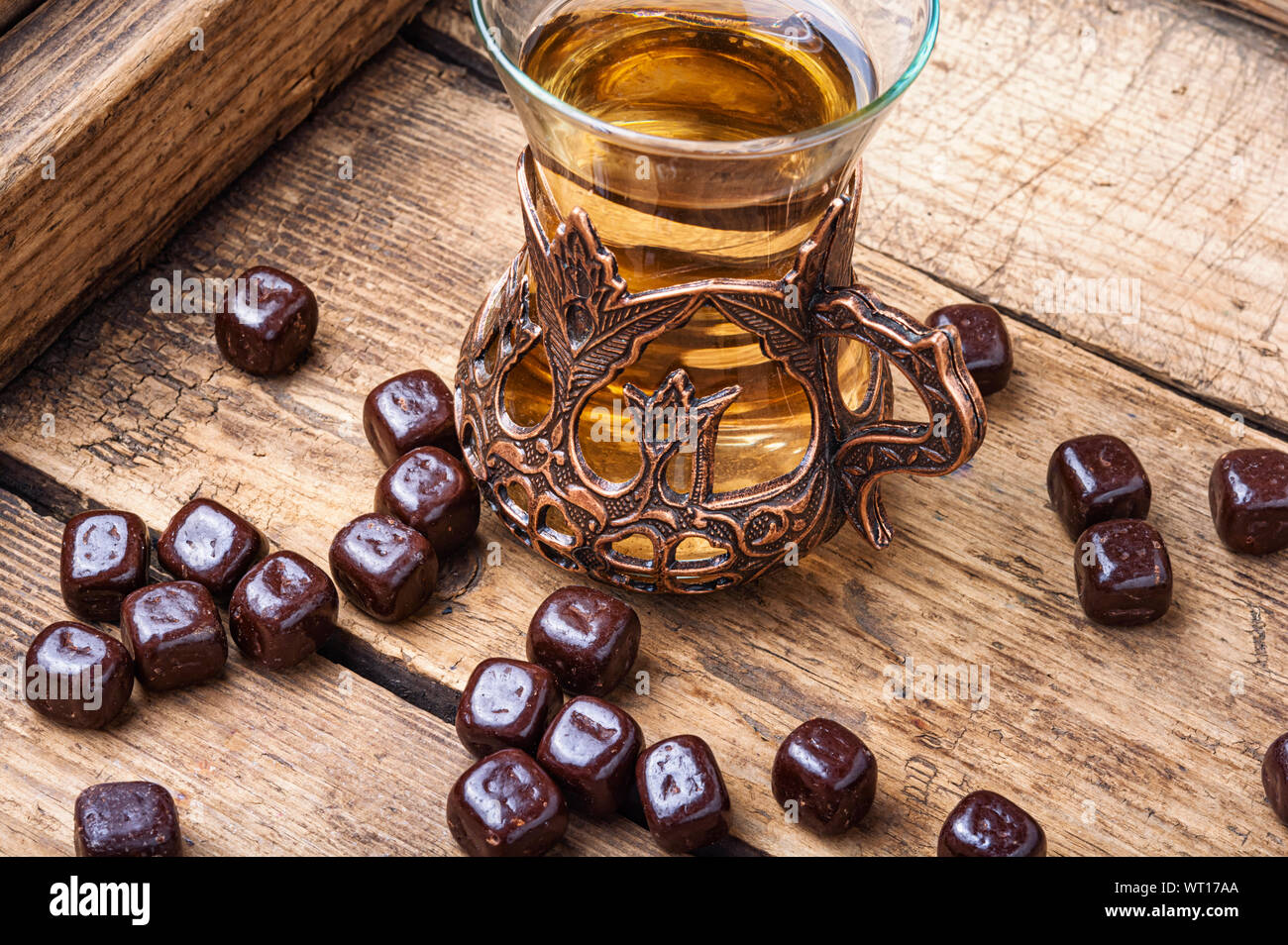 Eastern tea concept.Eastern tea in traditional glass with chocolate ...
