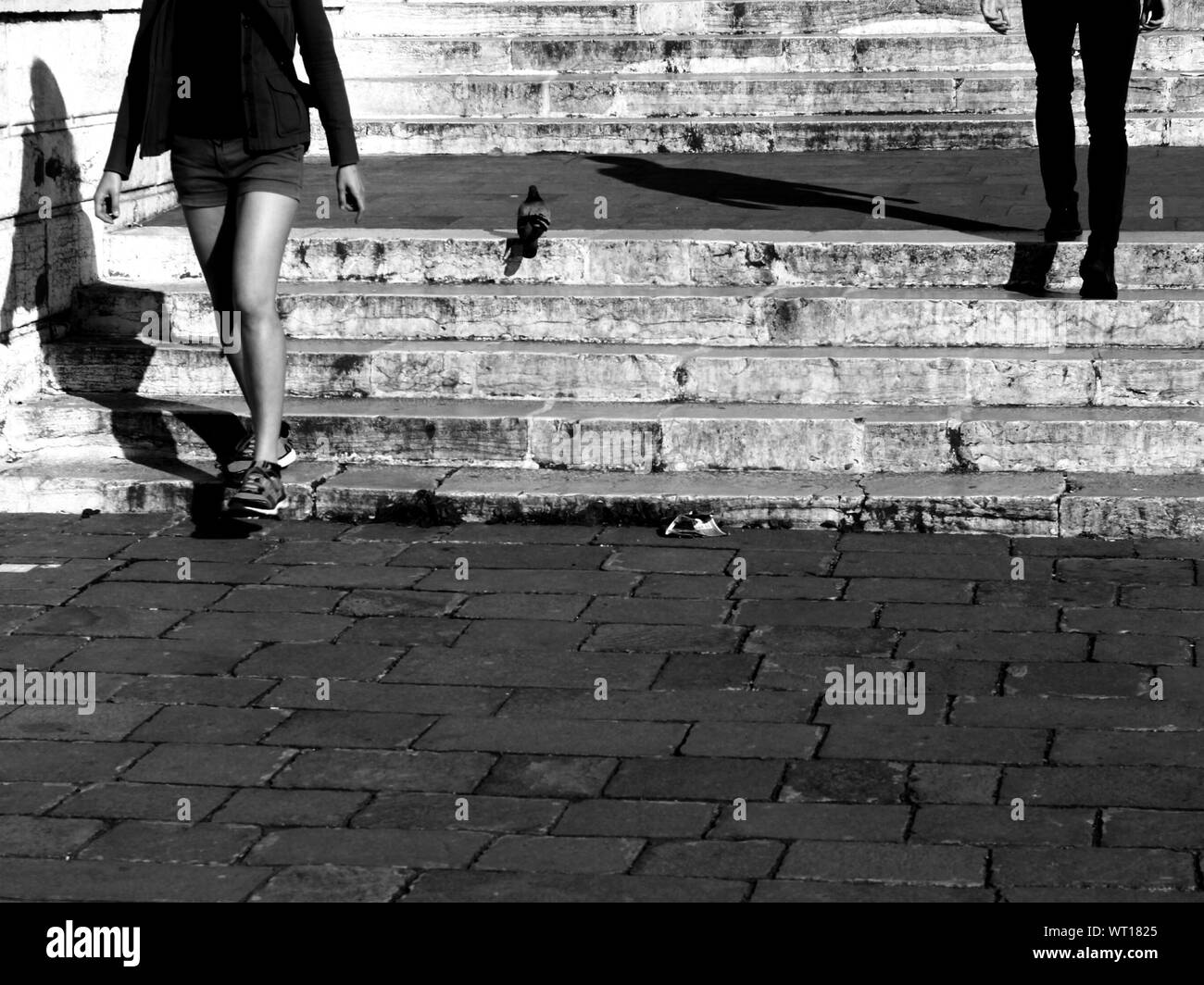 Two people walking down steps hi-res stock photography and images - Alamy