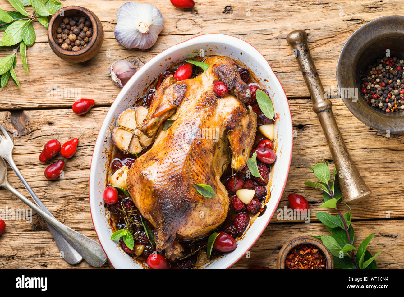 Baked chicken with dogwood.Roast chicken in berry sauce Stock Photo - Alamy