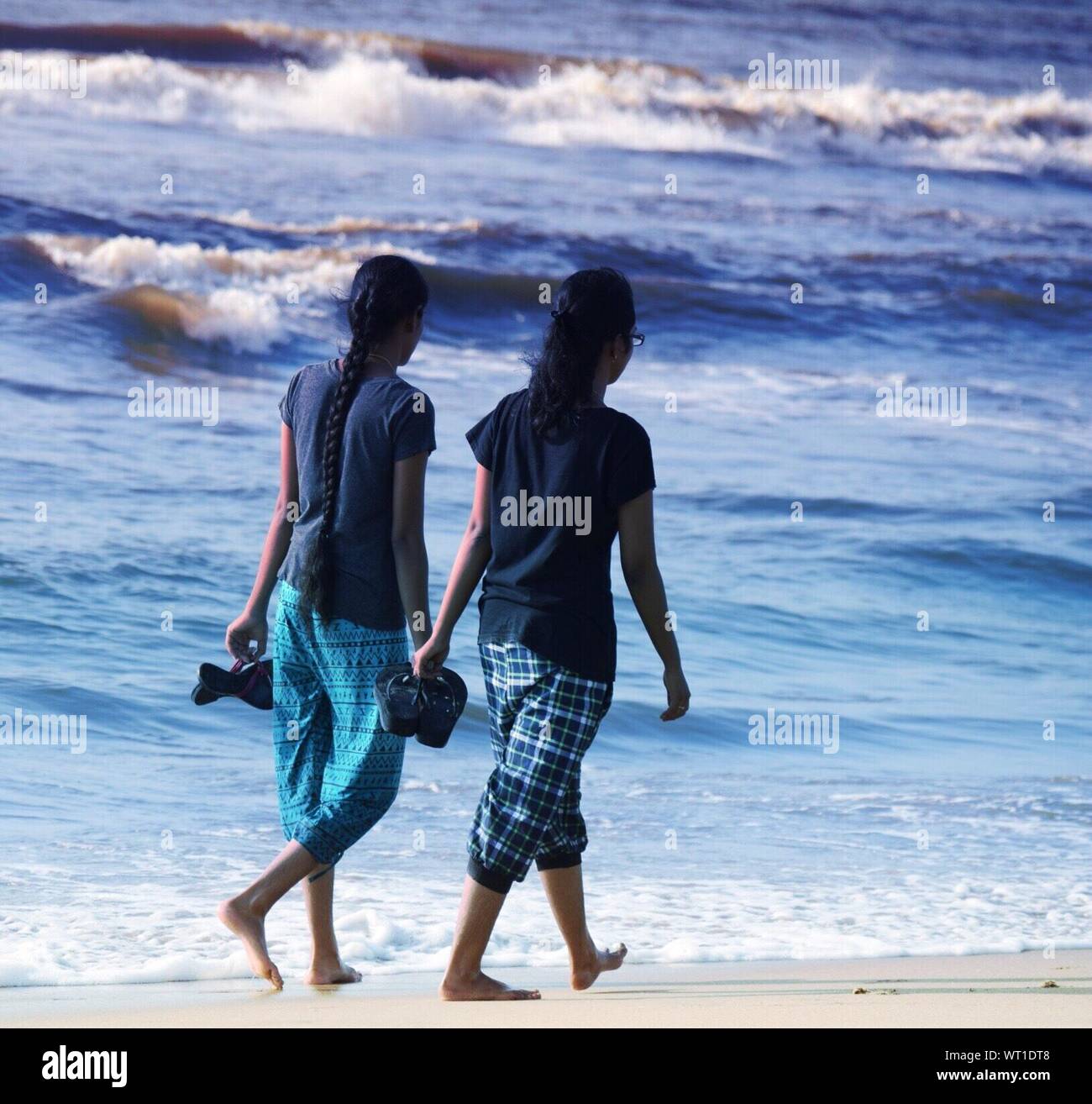 Two women on the shore hi-res stock photography and images - Alamy