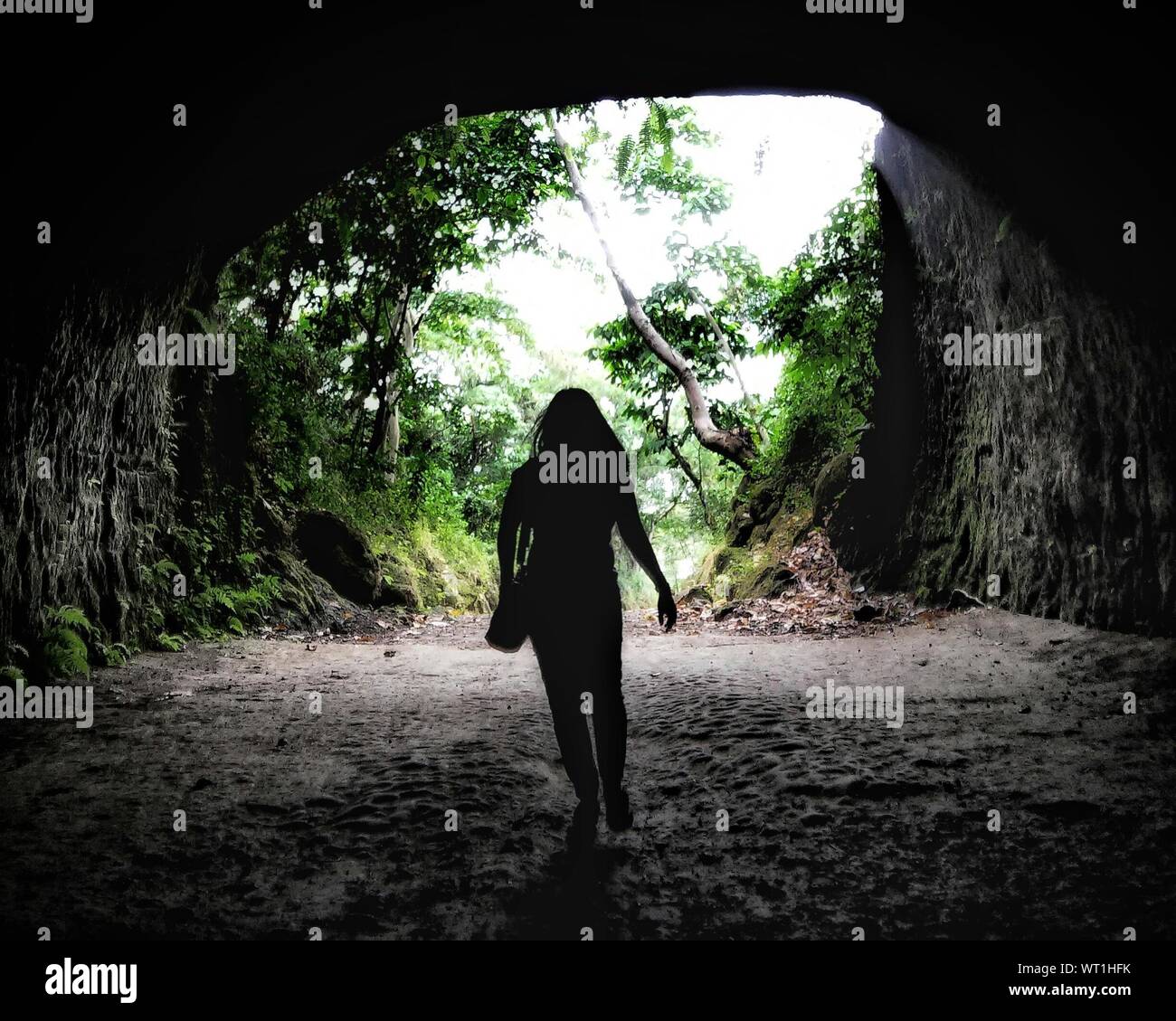 Silhouette woman walking in tunnel hi-res stock photography and images ...