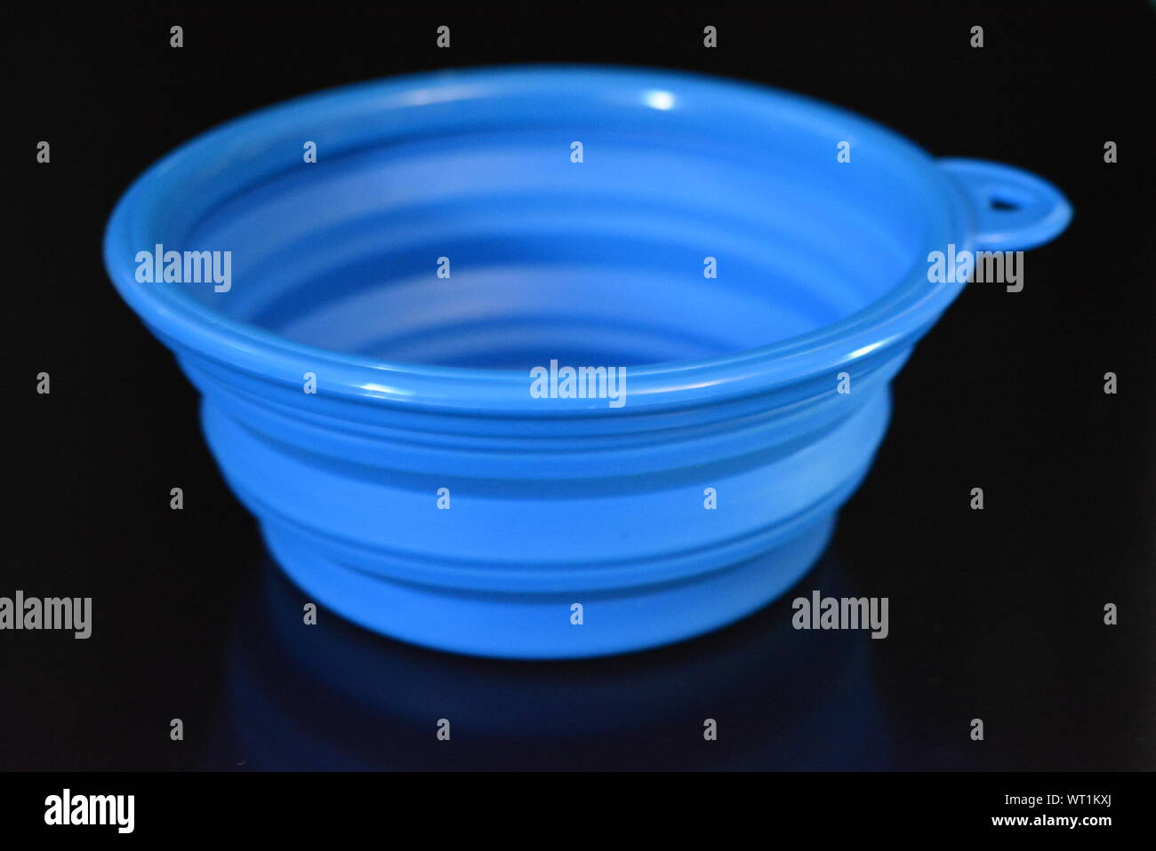 Blue folding and multifunctional rubber plate, a bowl with a plastic ...
