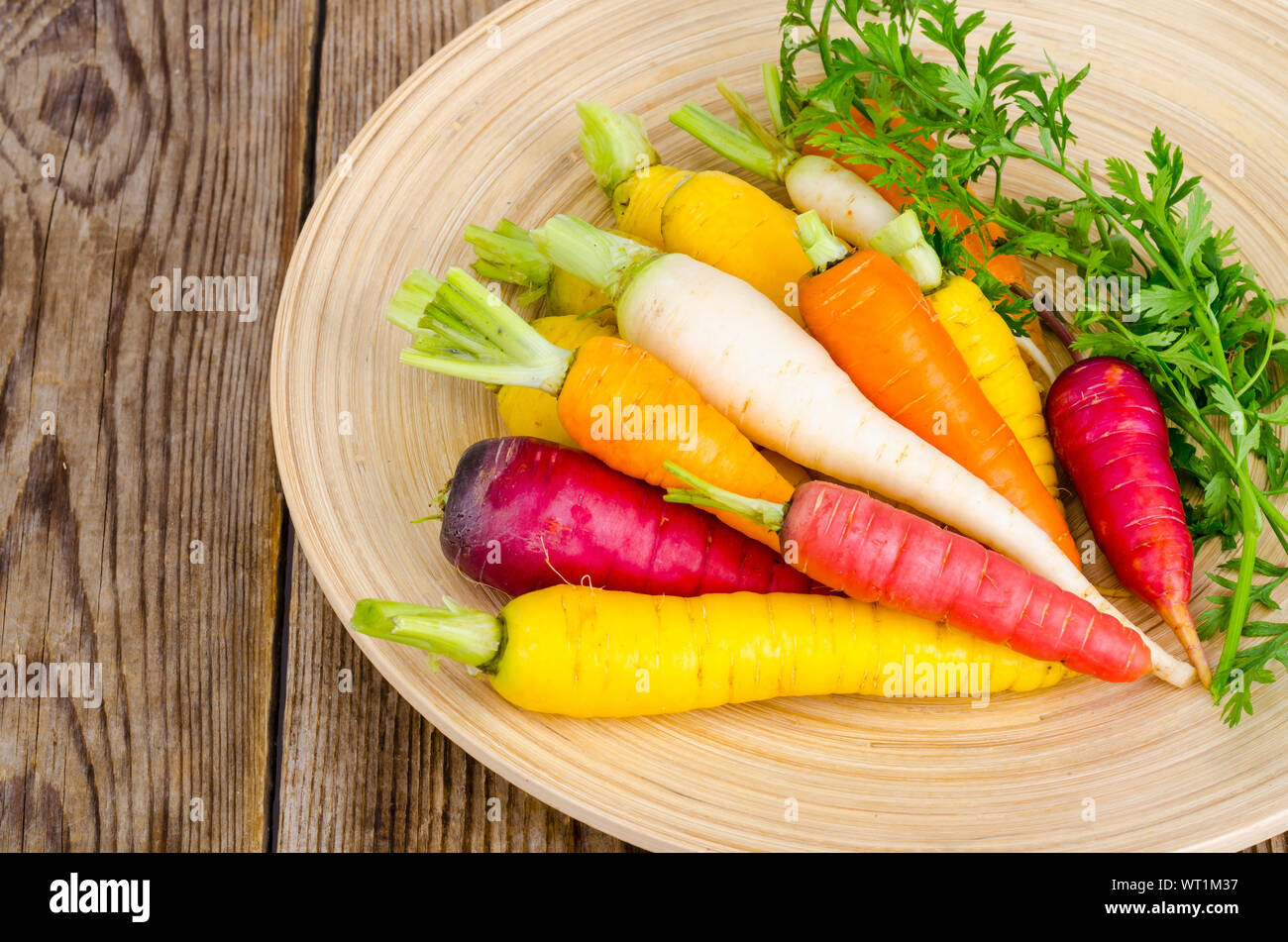 Fresh organic farm carrots of various types and colors. Studio Photo ...