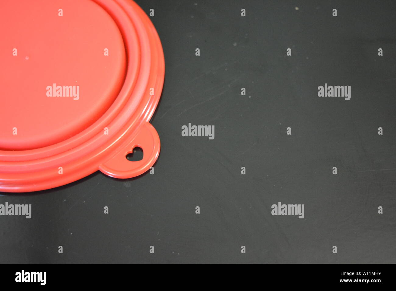 Red folding and multifunctional rubber plate, a bowl with a plastic ...