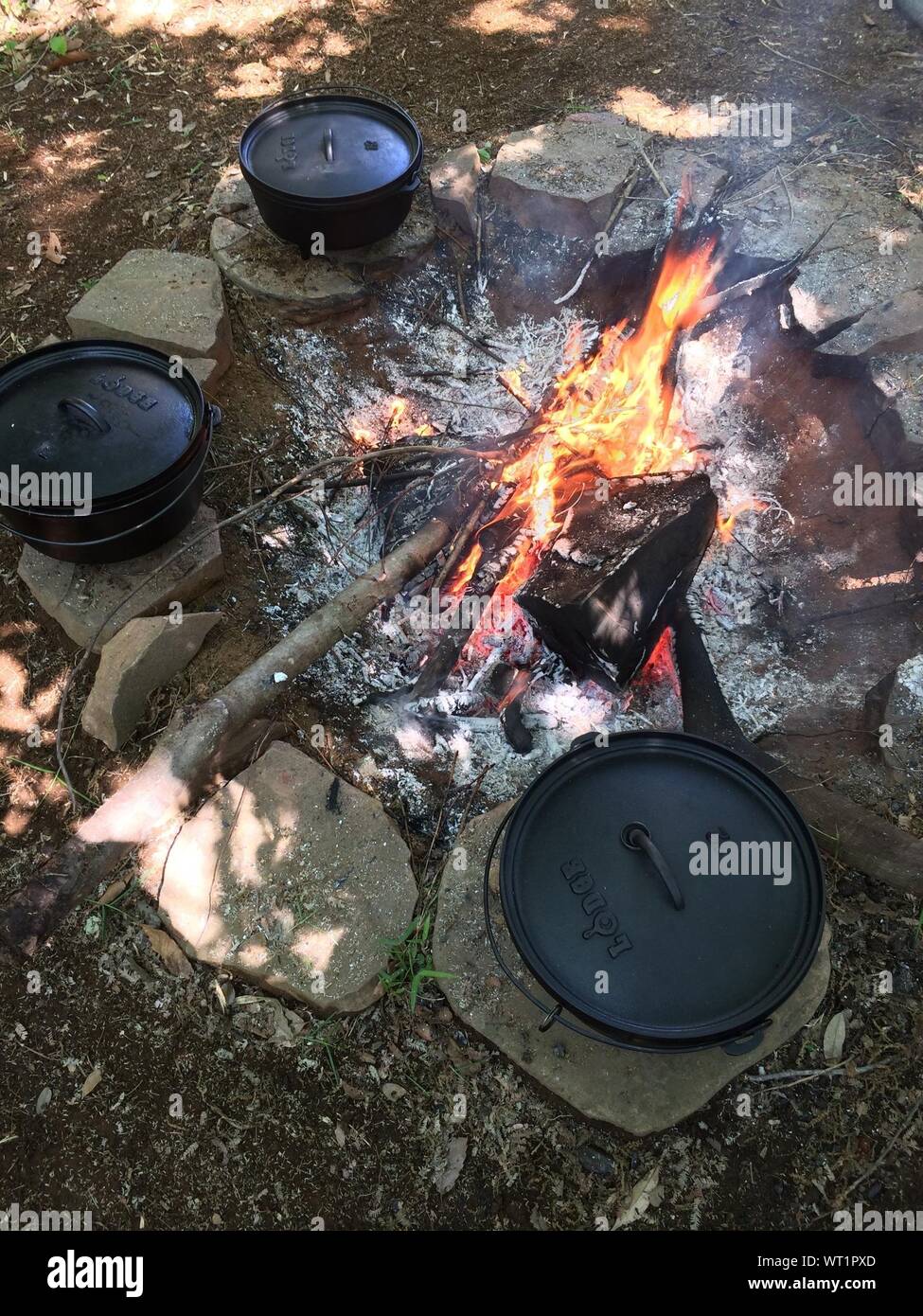 Top View Image Of Pots Near Fire Flames Stock Photo - Alamy