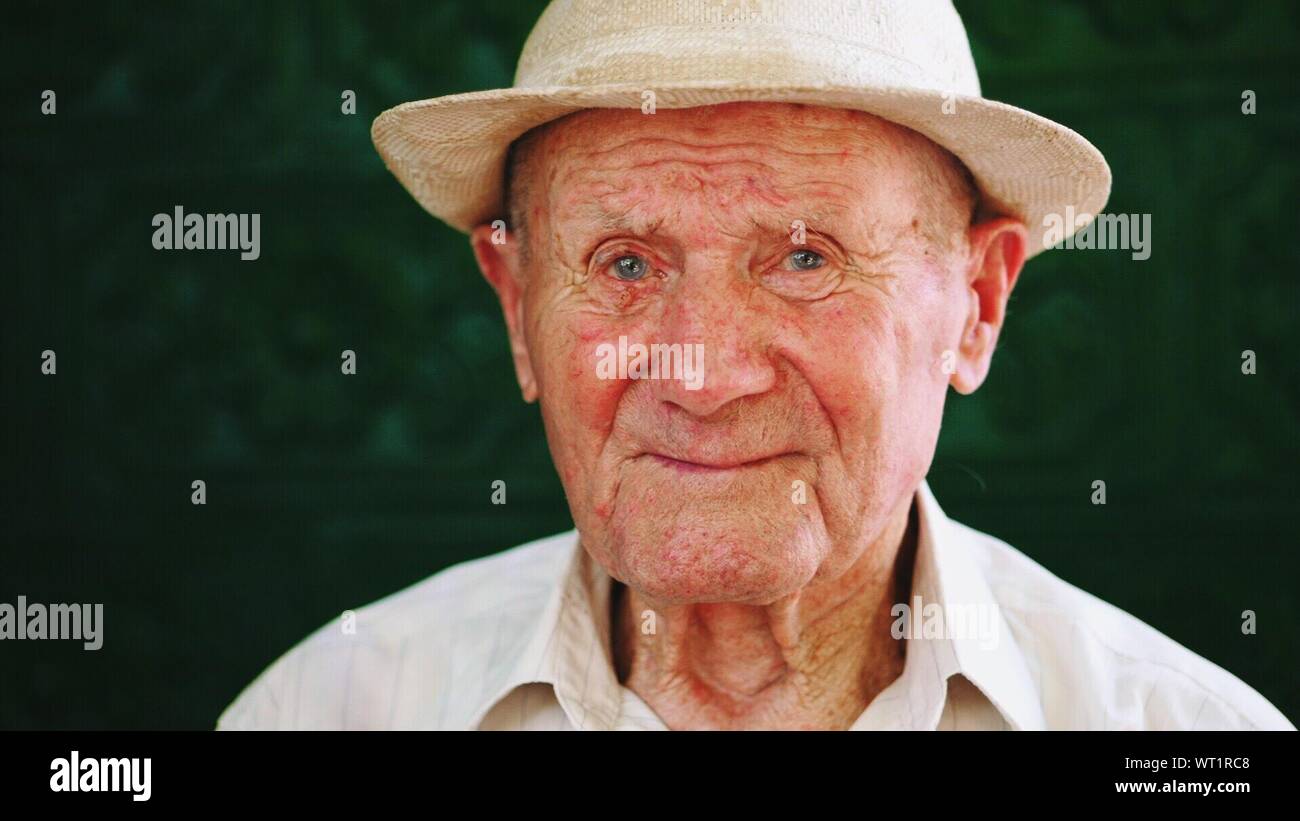 Man looking down with hat hi-res stock photography and images - Alamy