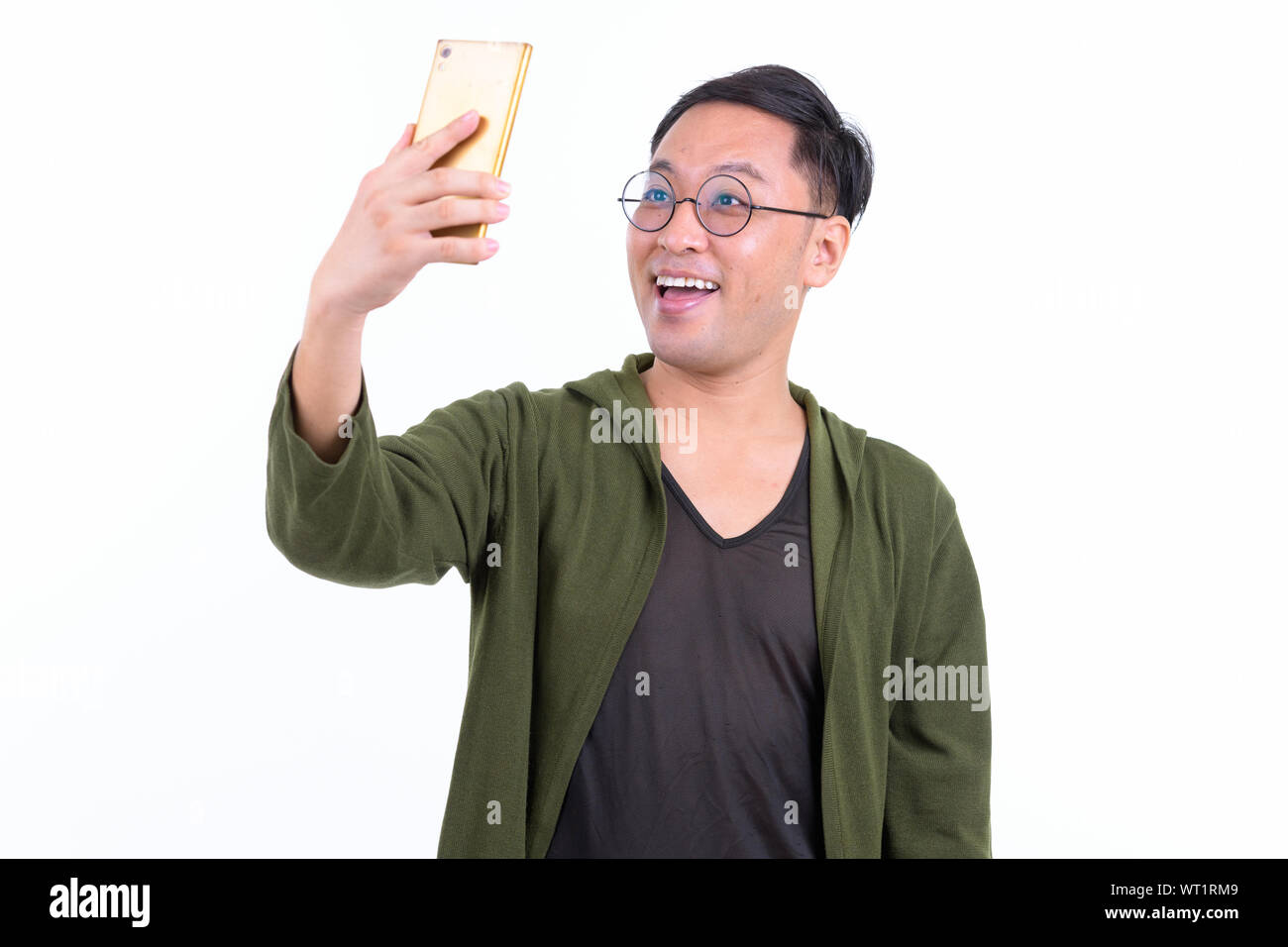 Happy Japanese man with eyeglasses taking selfie Stock Photo - Alamy