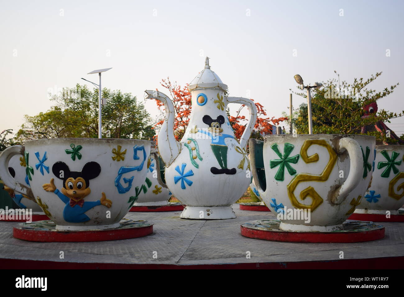 kettle and tea cup ride on a children park Stock Photo - Alamy