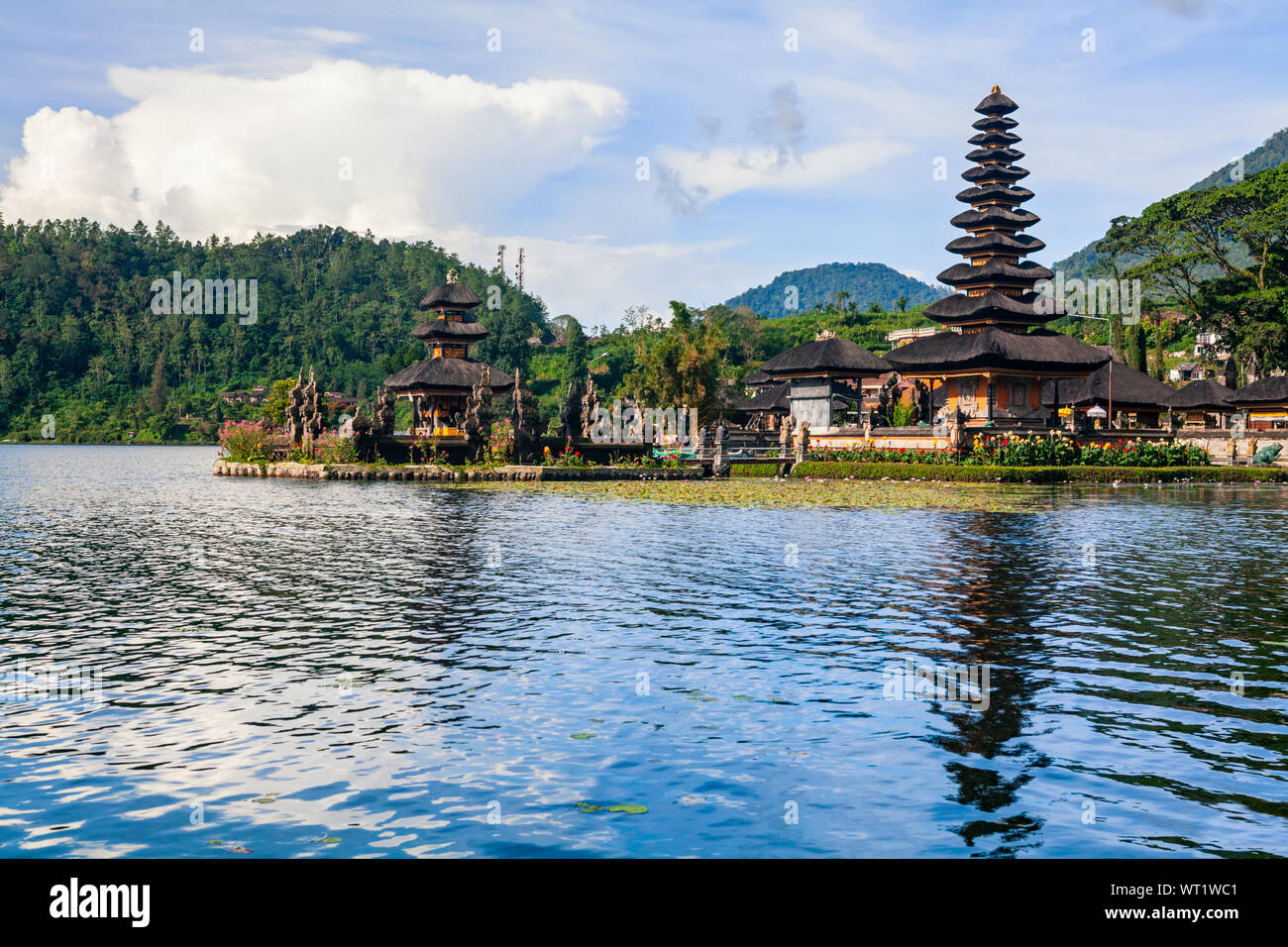 Scenic view during boat water walk at Beratan lake in Bedugul. Ancient ...