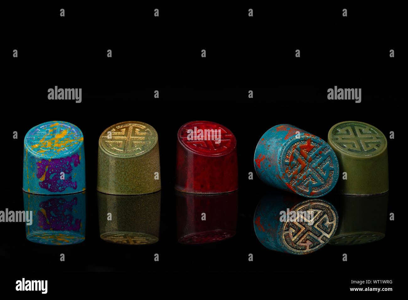 Beautiful modern chocolate candy set on black background Stock Photo ...