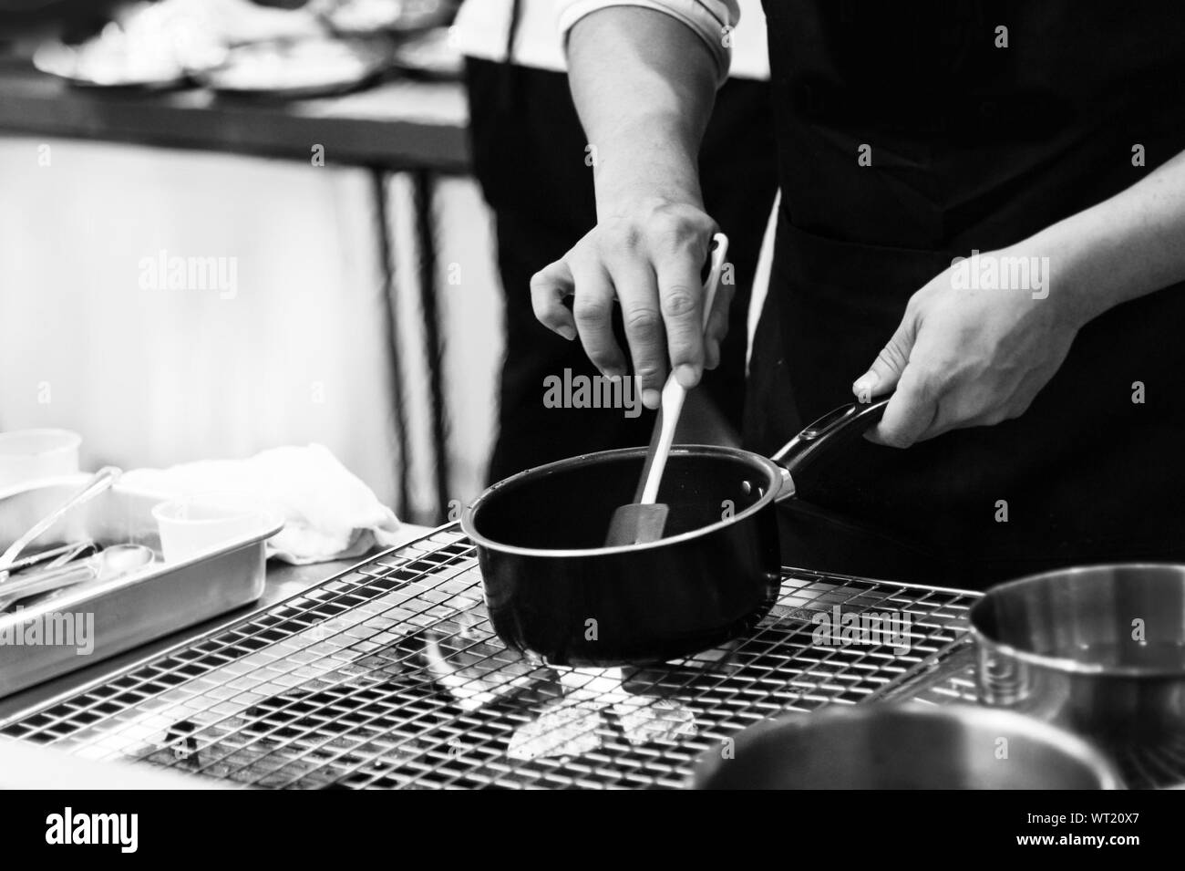 chef preparing food, chef cooking in a kitchen, chef at work, Black ...