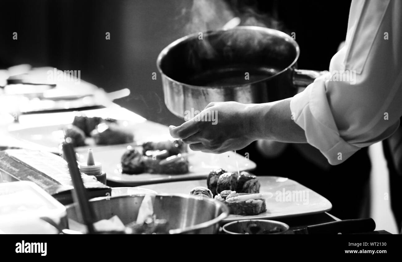 chef preparing food, chef cooking in a kitchen, chef at work, Black ...