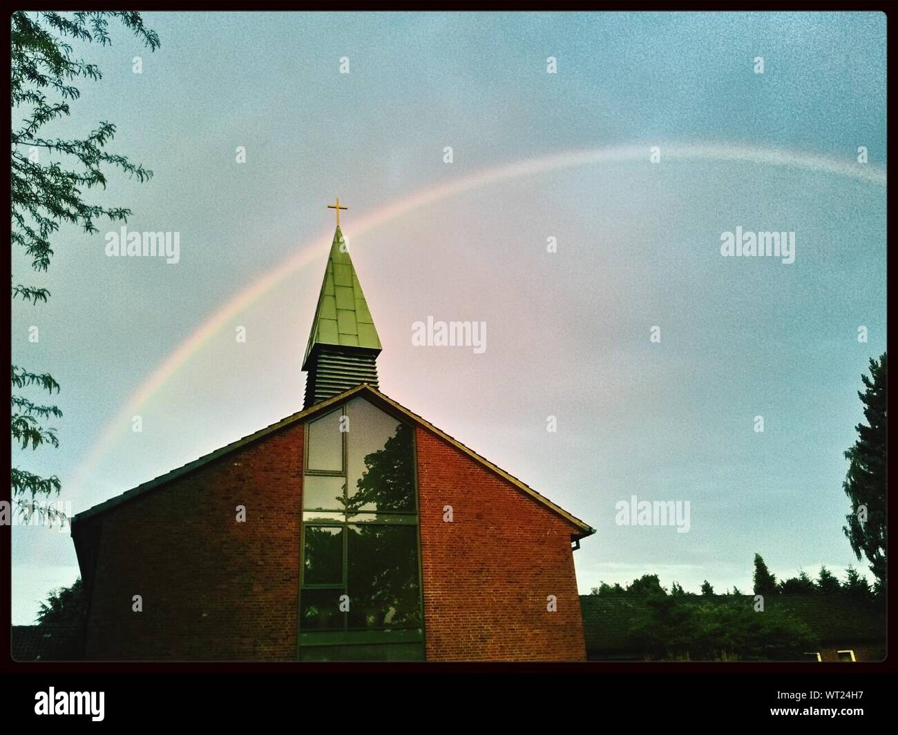 Rainbow Over Church High Resolution Stock Photography and Images - Alamy