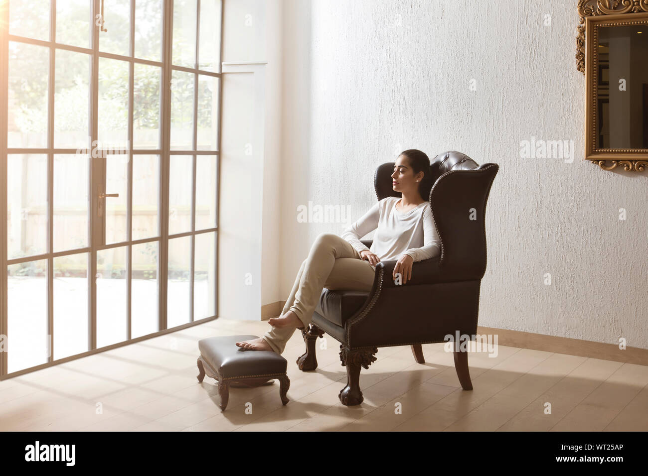 Woman relaxing meditating home sitting hi-res stock photography and ...