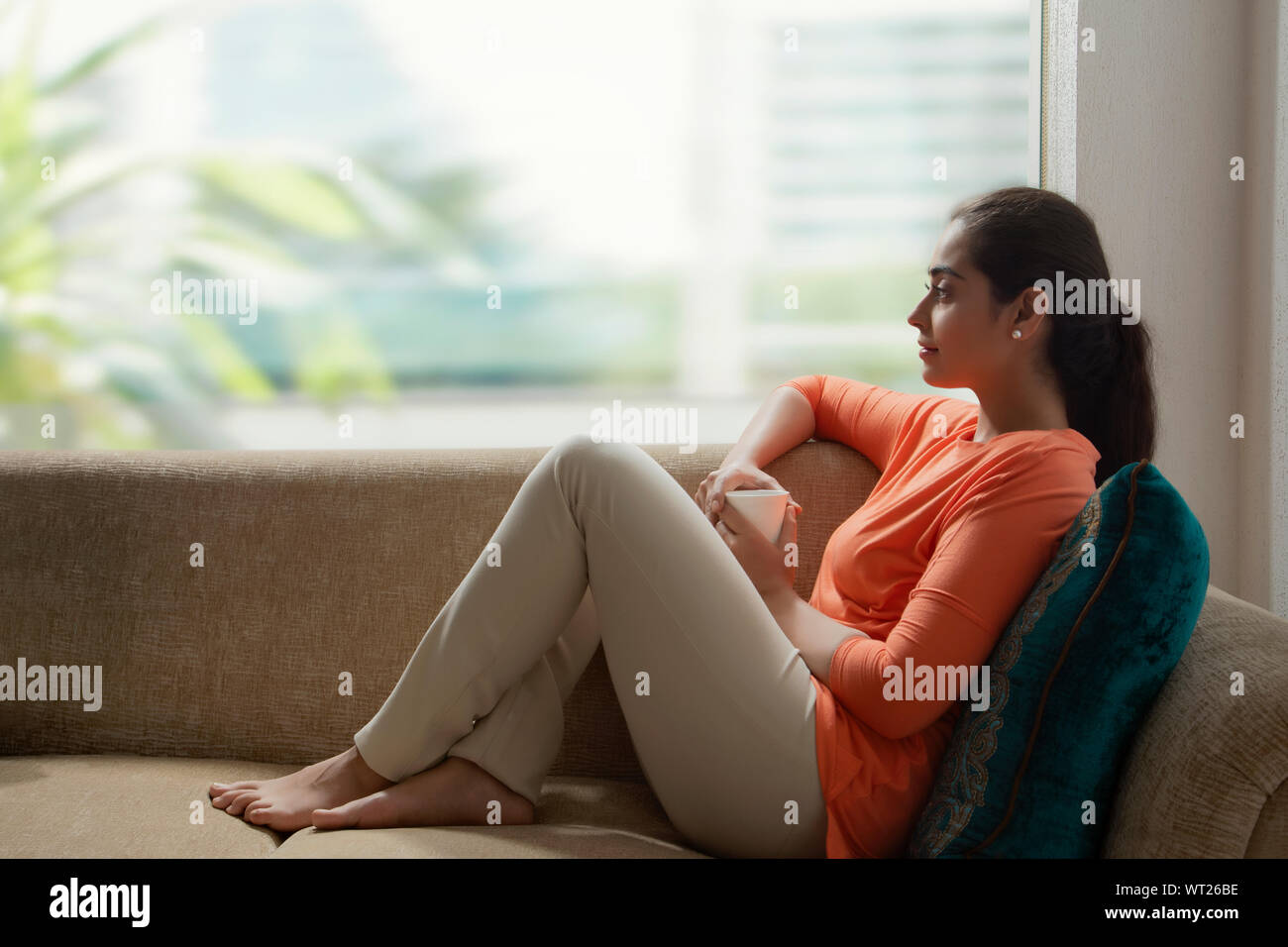 Relaxing on the couch hi-res stock photography and images - Alamy