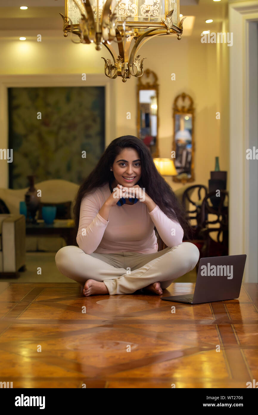Woman sitting folded legs on hi-res stock photography and images - Alamy