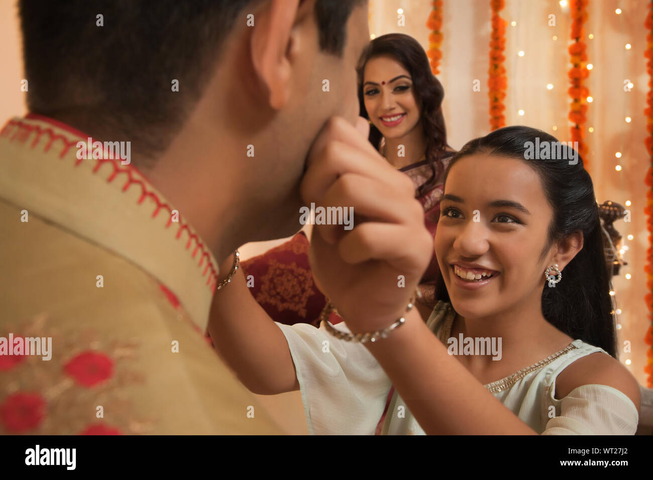 daughter pulling her fathers cheeks Stock Photo - Alamy