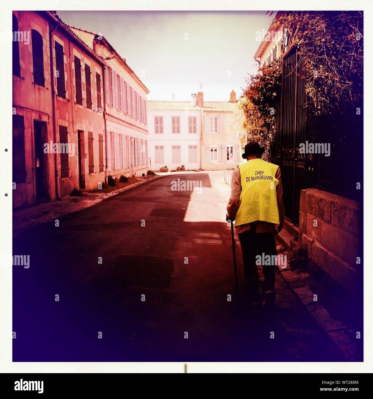 Man walking down street hi-res stock photography and images - Alamy