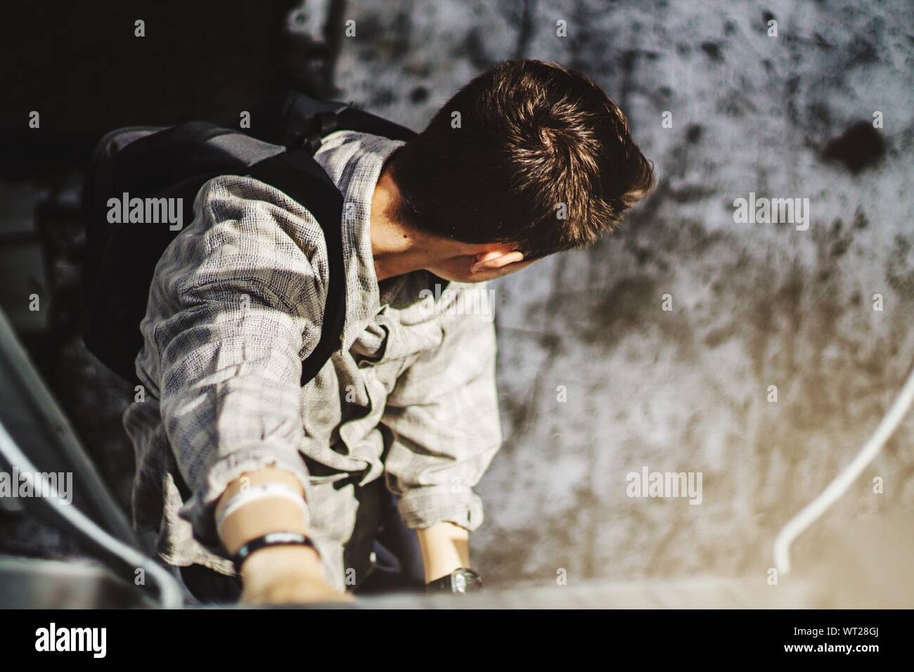 Man climbing down ladder hi-res stock photography and images - Alamy