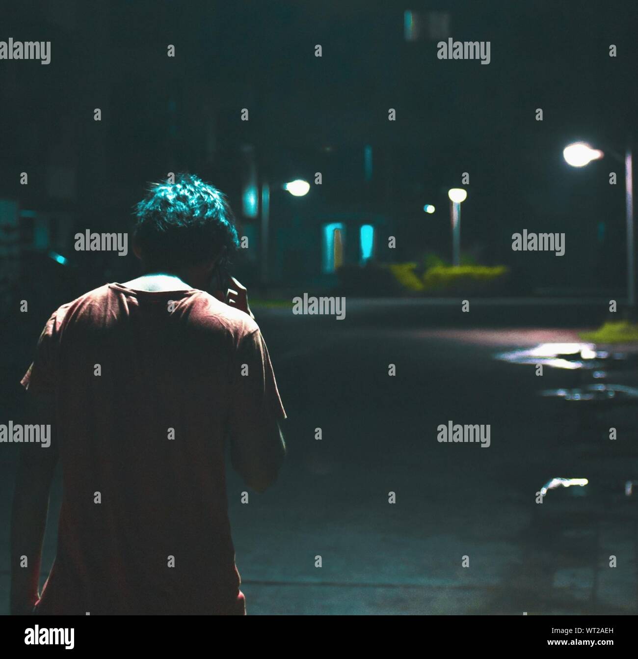 Man walking rear view night hi-res stock photography and images - Alamy