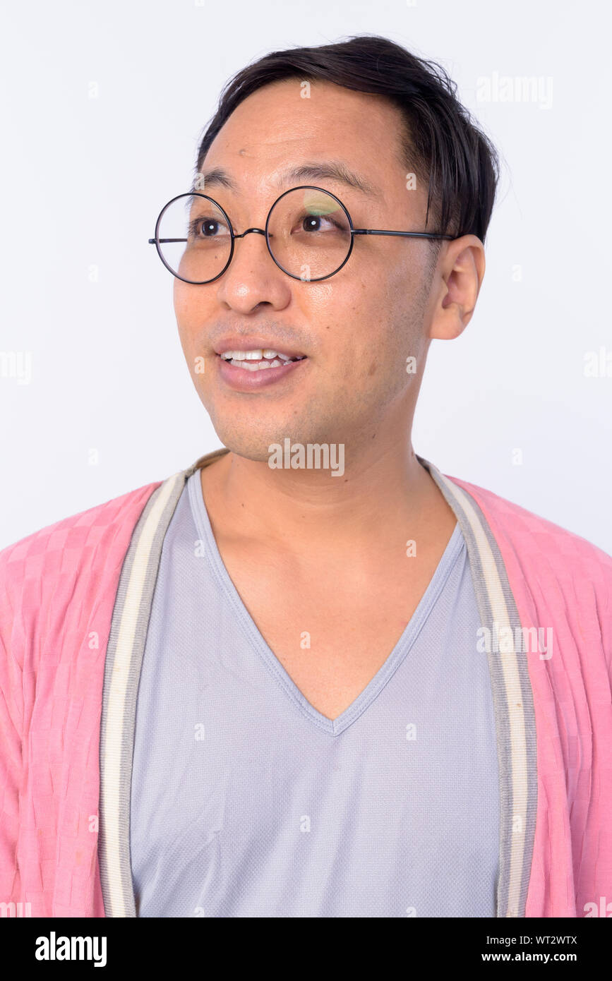 Face of happy Japanese man with eyeglasses thinking Stock Photo - Alamy