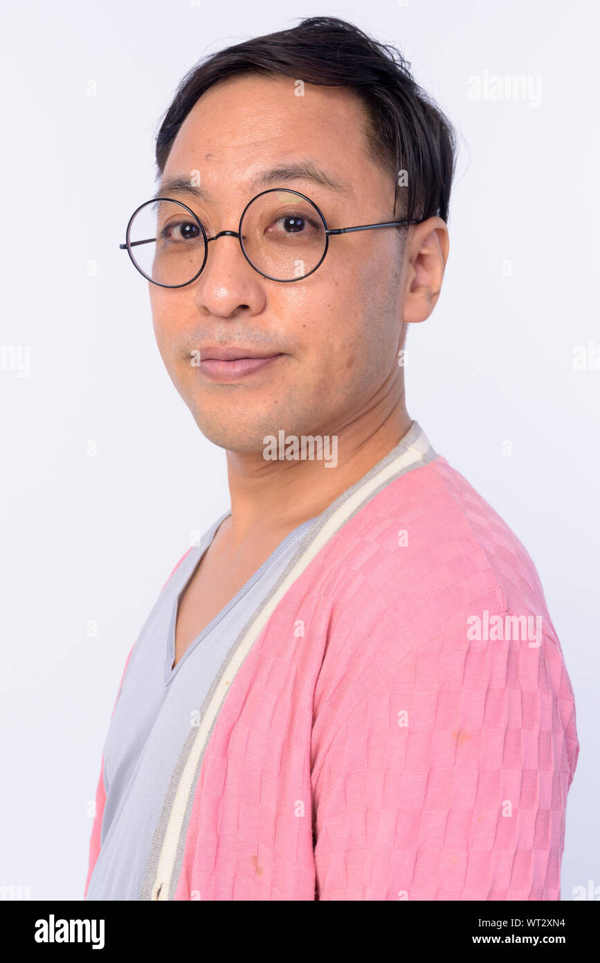 Closeup profile view of Japanese man with eyeglasses looking at camera ...