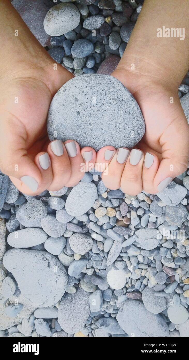 Woman holding stone hi-res stock photography and images - Alamy