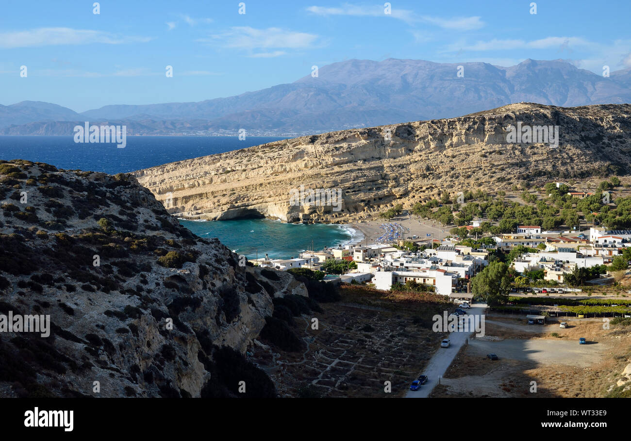 Top view of the bay on Matala beach and caves at sunset, Crete island ...