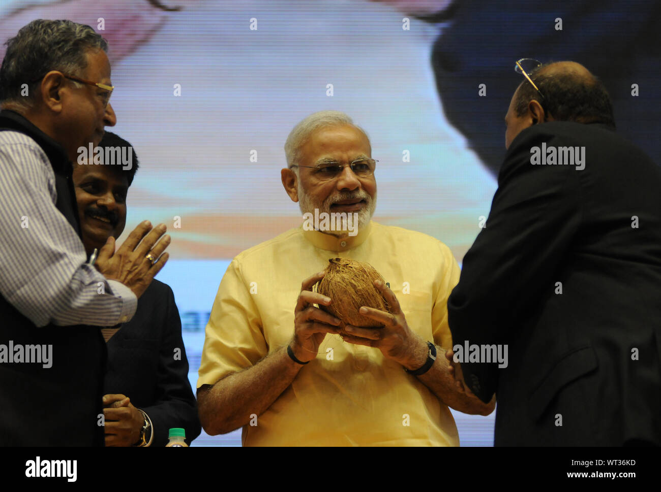 Indian Prime Minister Narendra Modi holding a coconut, in New Delhi ...