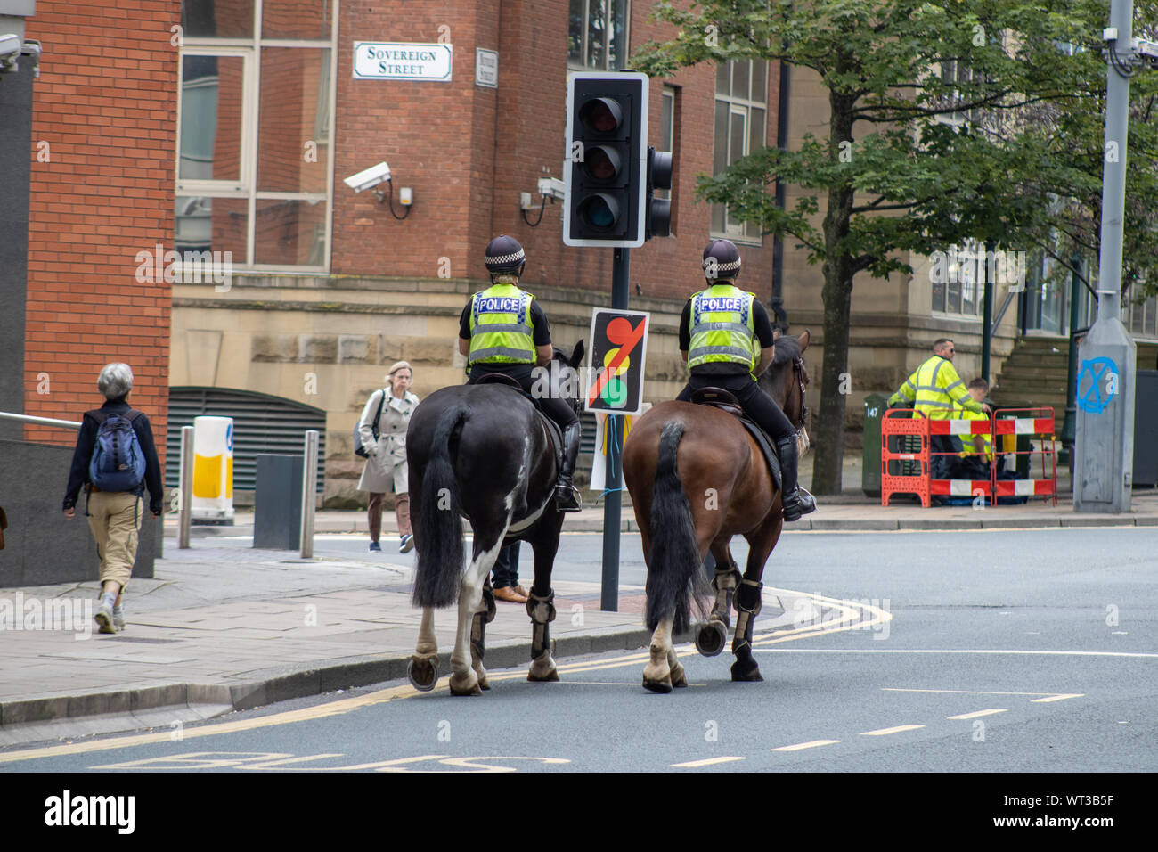 Leeds UK, 18th July 2019: Police officers riding a police horse in the ...