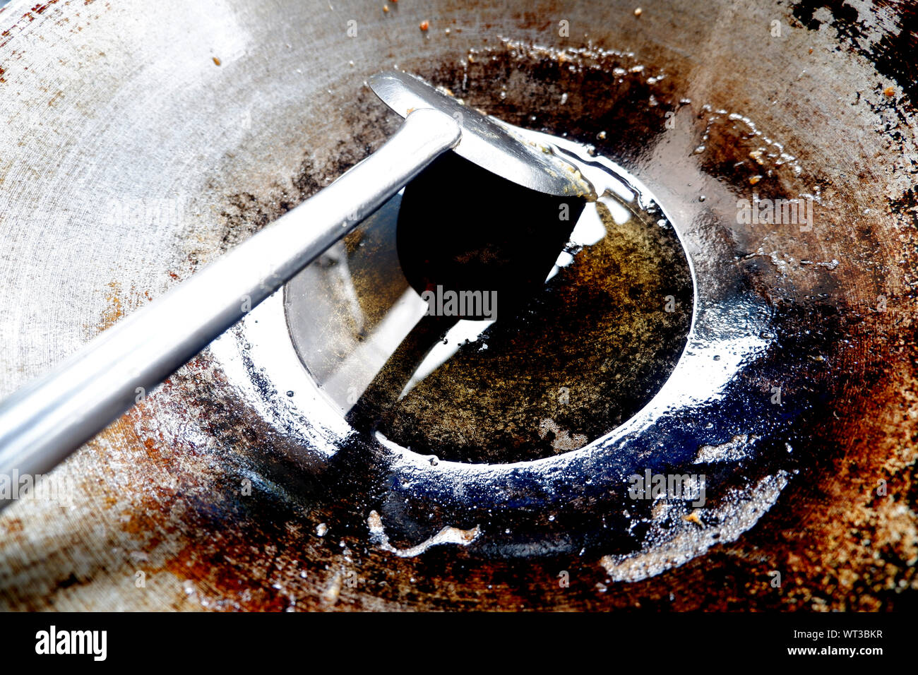 yellow palm oil in dirty big metal pan Stock Photo - Alamy