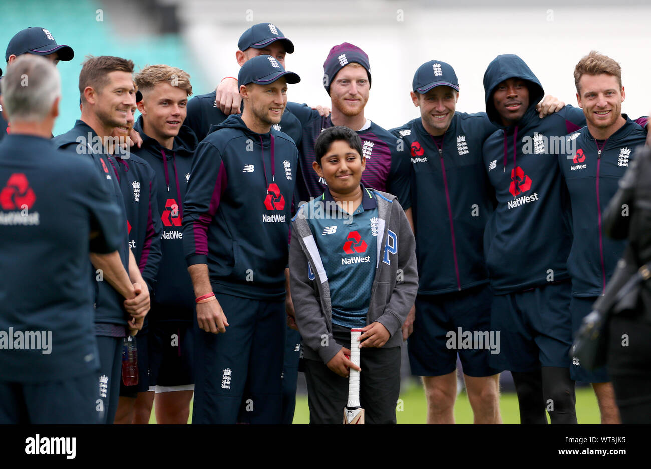 England players pose with a young fan during the nets session at The ...