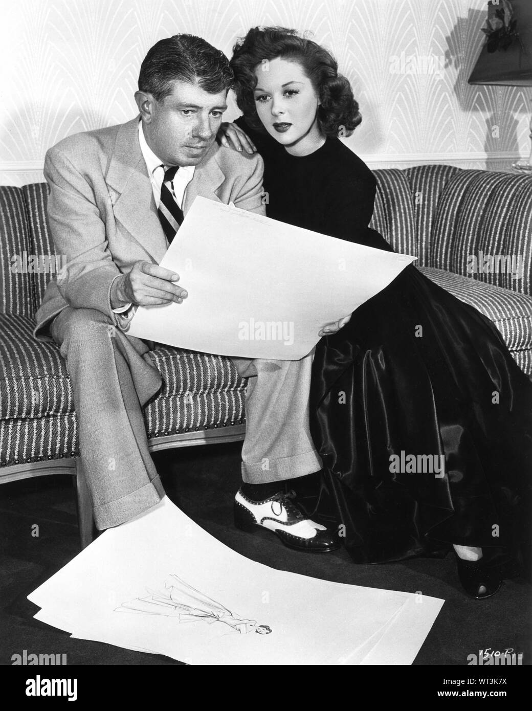 Costume Designer TRAVIS BANTON and SUSAN HAYWARD look at sketches of ...