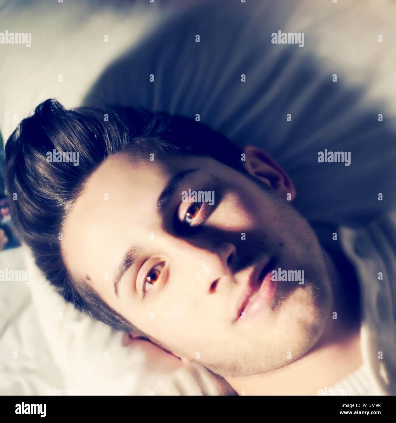 Man lying in bed hi-res stock photography and images - Alamy
