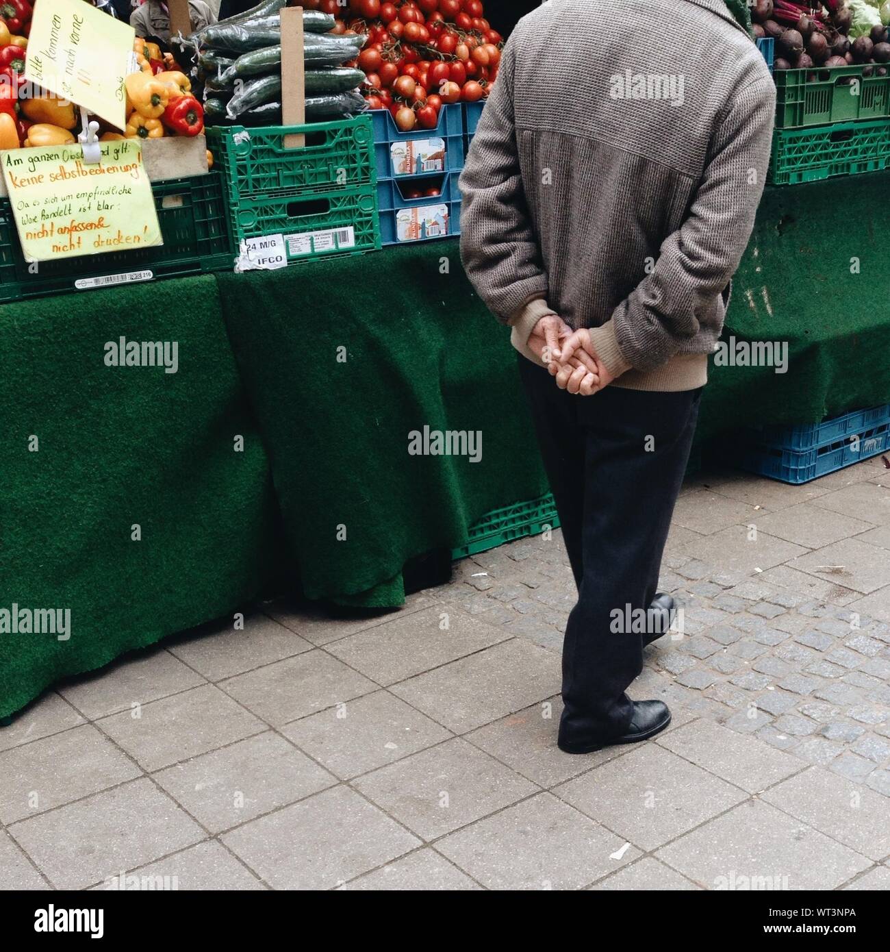 Old Man Walking In Local Market Stock Photo - Alamy