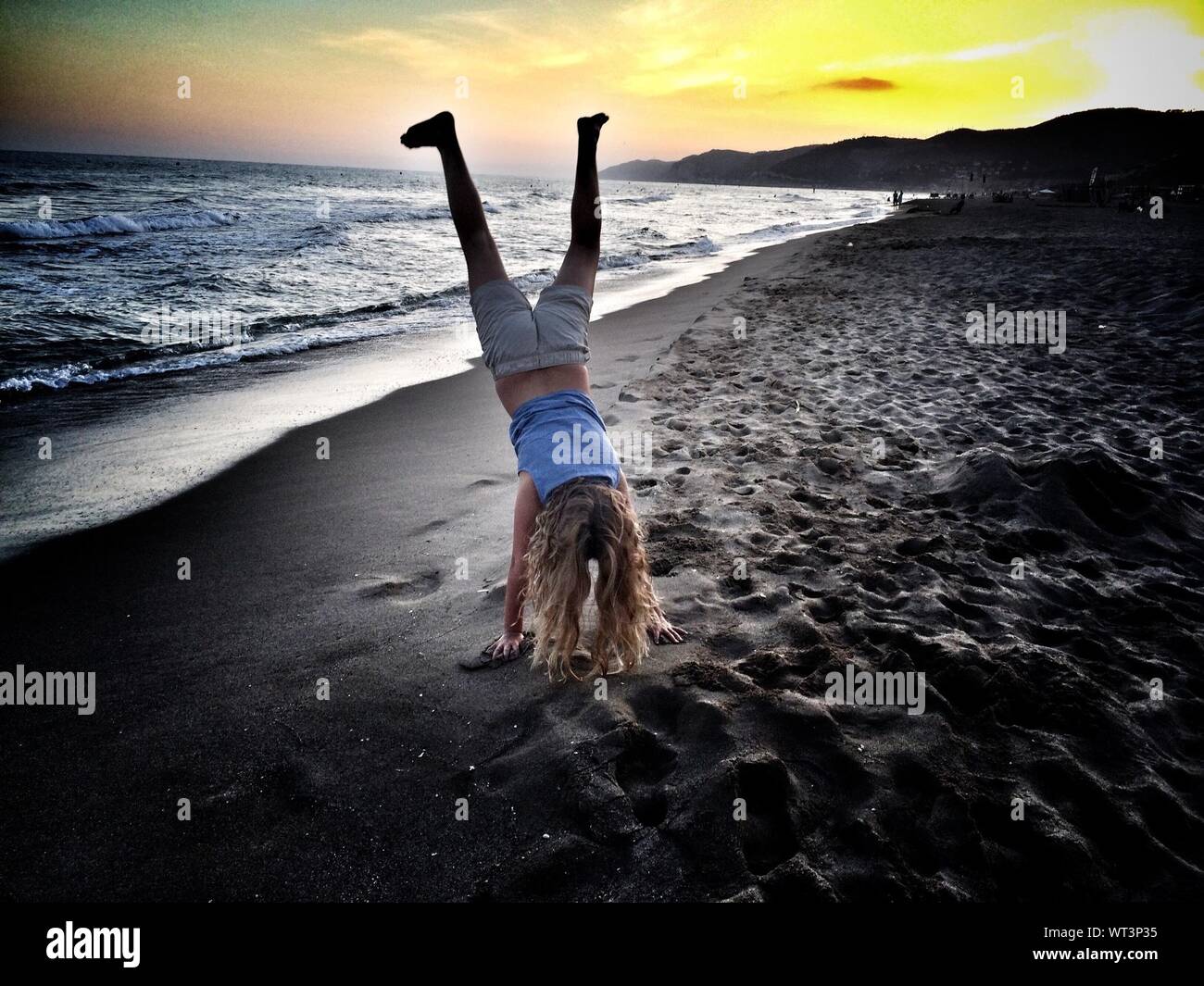 Doing handstand in sea hi-res stock photography and images - Alamy