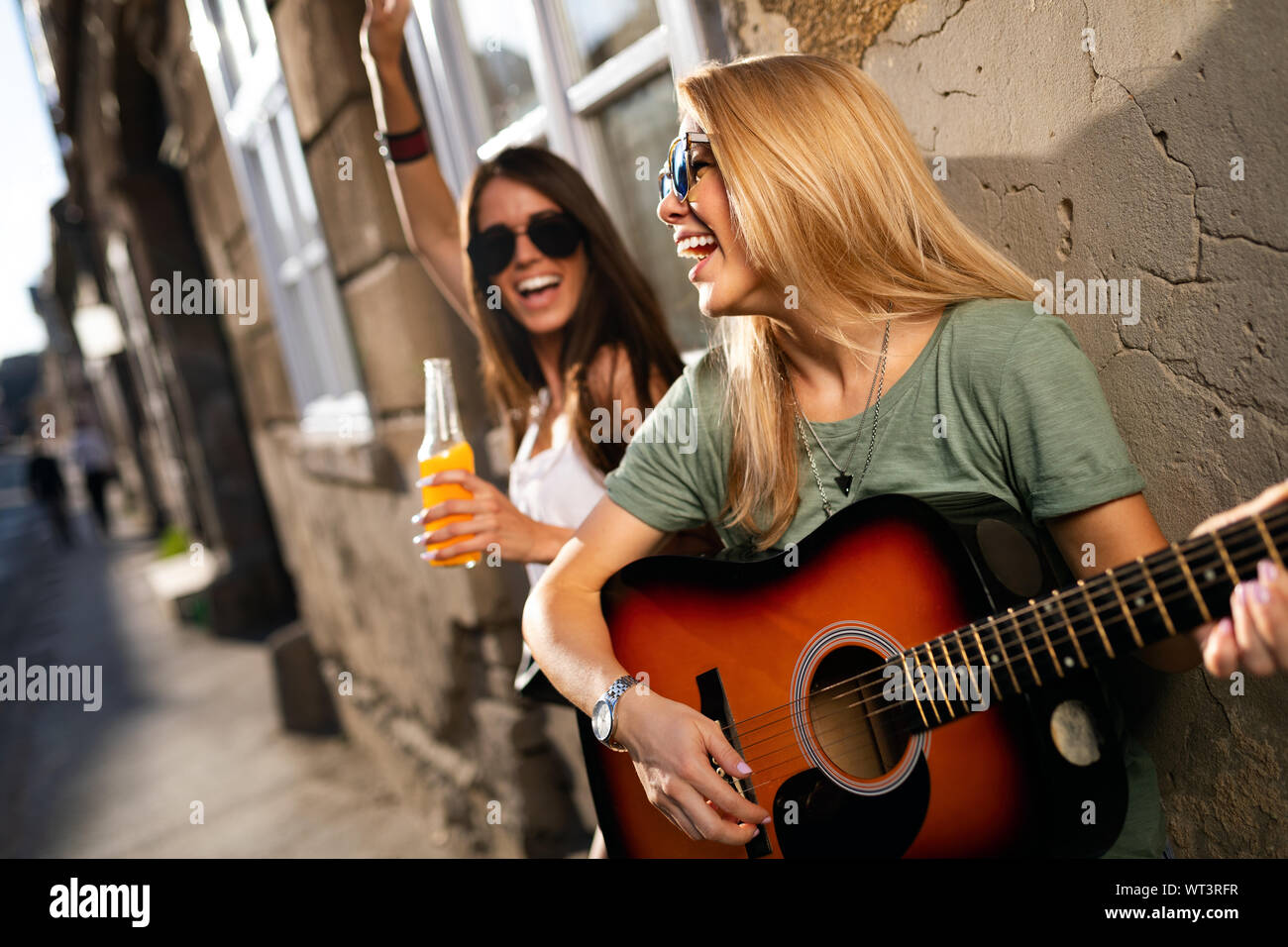 Happy young people having fun spending good time together Stock Photo ...