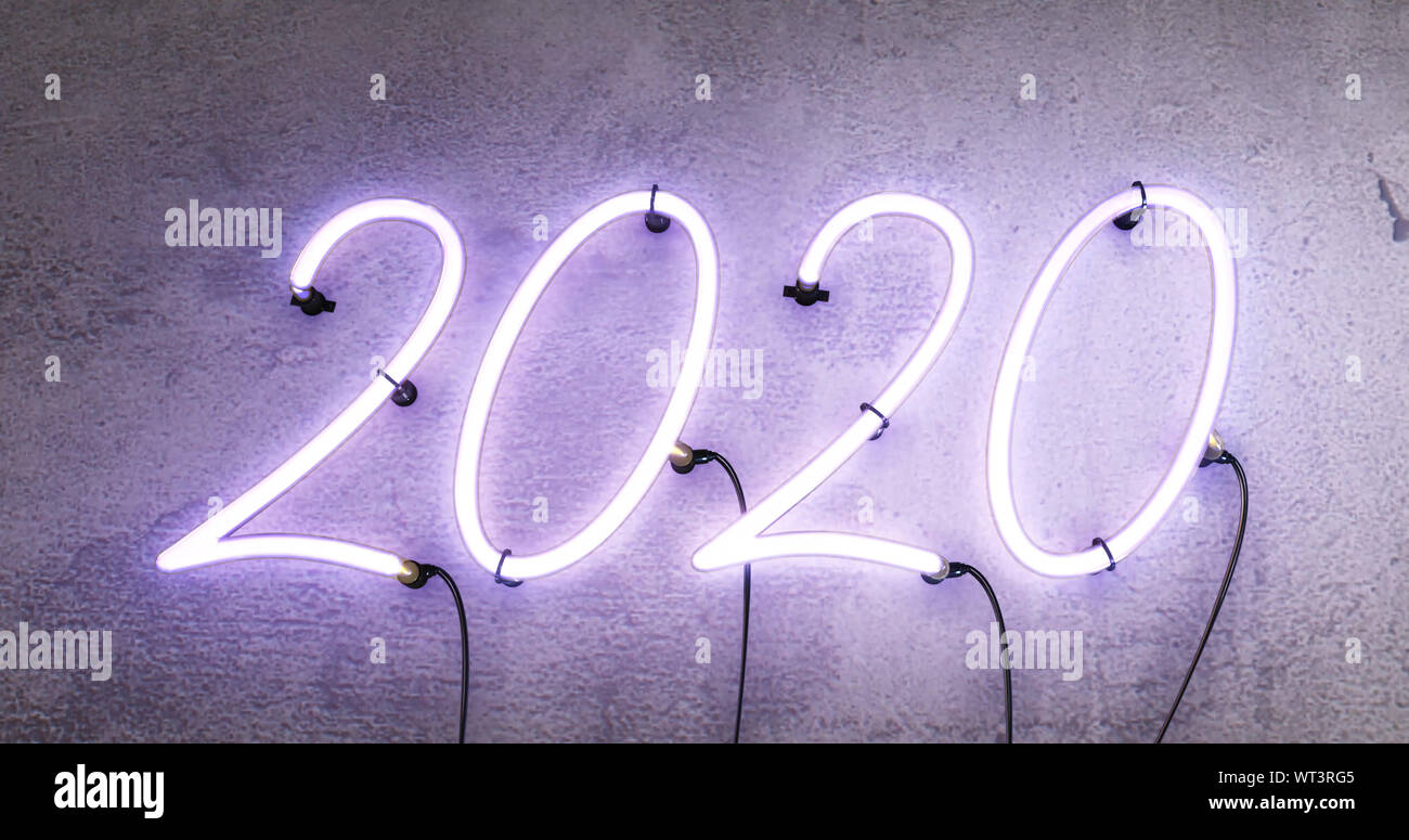 Neon pink/purple sign saying the word 2020, New Years eve sign Stock ...