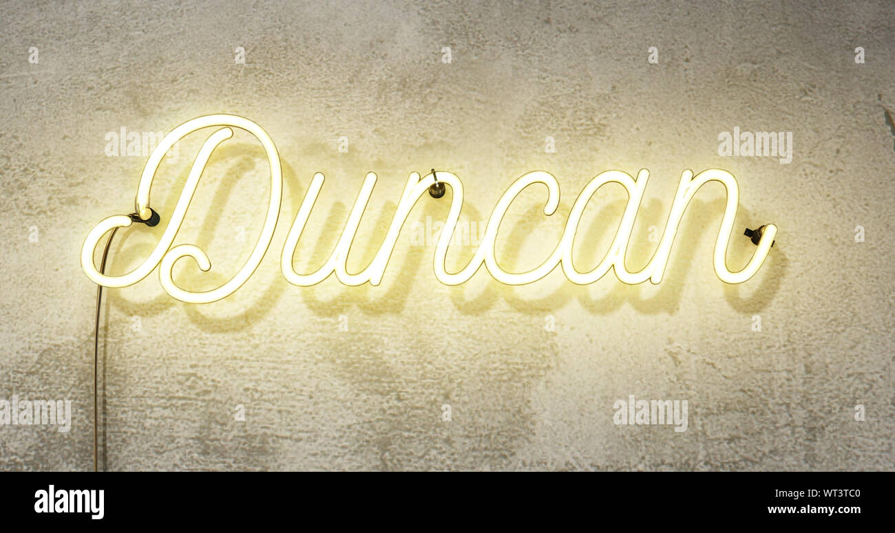 Neon sign saying the name Duncan in bright white Stock Photo - Alamy