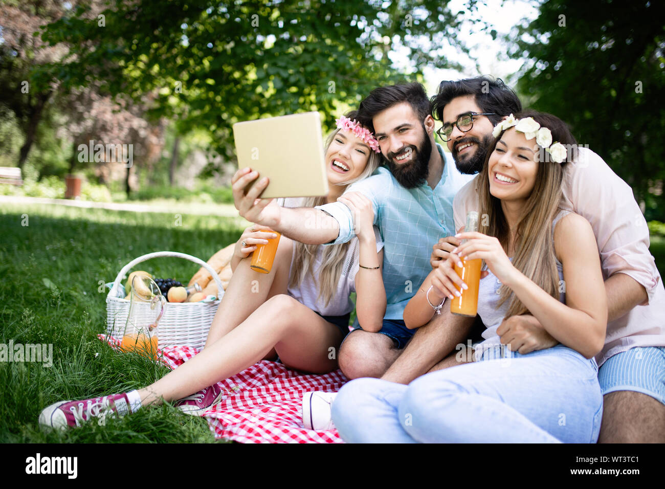 Happy young friends having fun outside in nature, taking selfie Stock ...