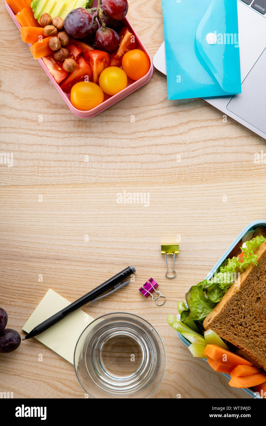 Flat lay with healthy lunch dishes variety: sandwich, salad and fruit ...