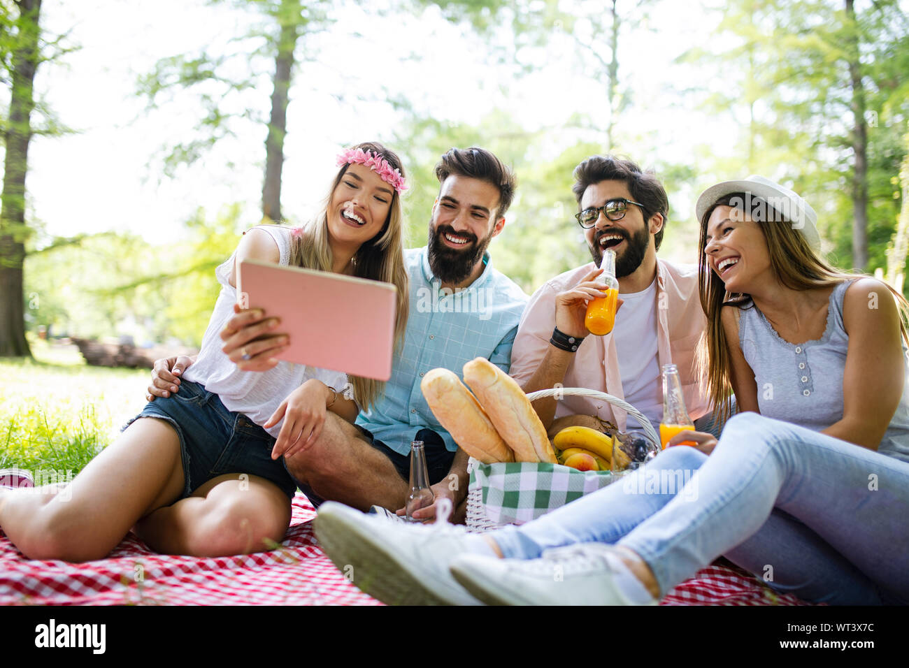 Happy young friends having fun outside in nature, taking selfie Stock ...