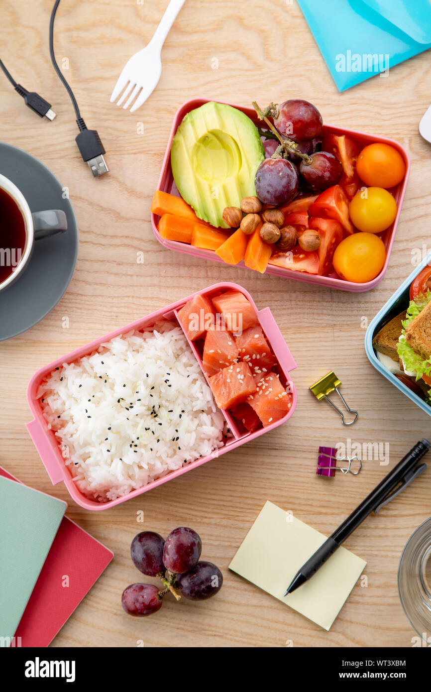 Flat lay with healthy lunch dishes variety: sandwich, salad and fruit ...