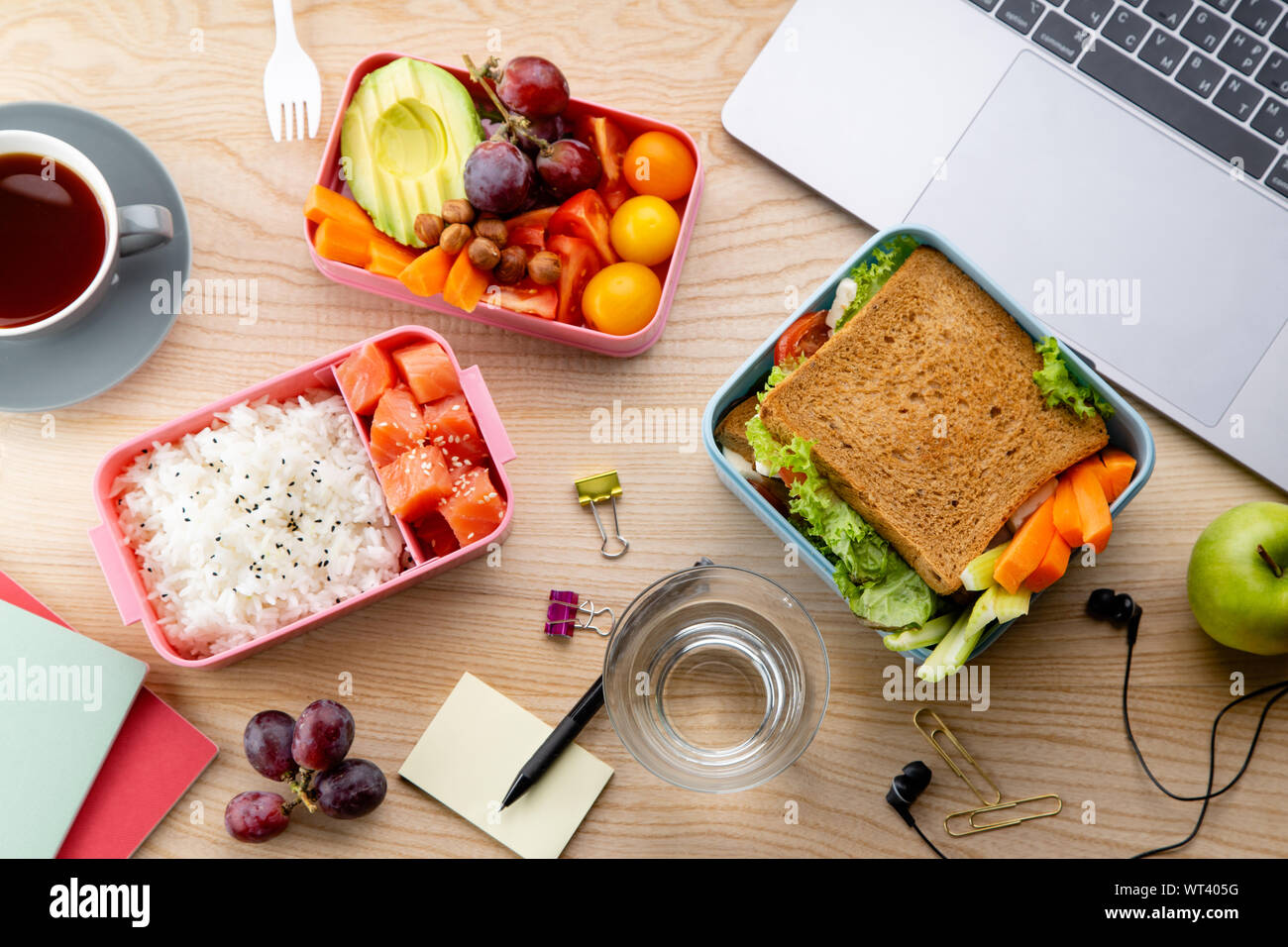 Flat lay with healthy lunch dishes variety: sandwich, salad and fruit ...
