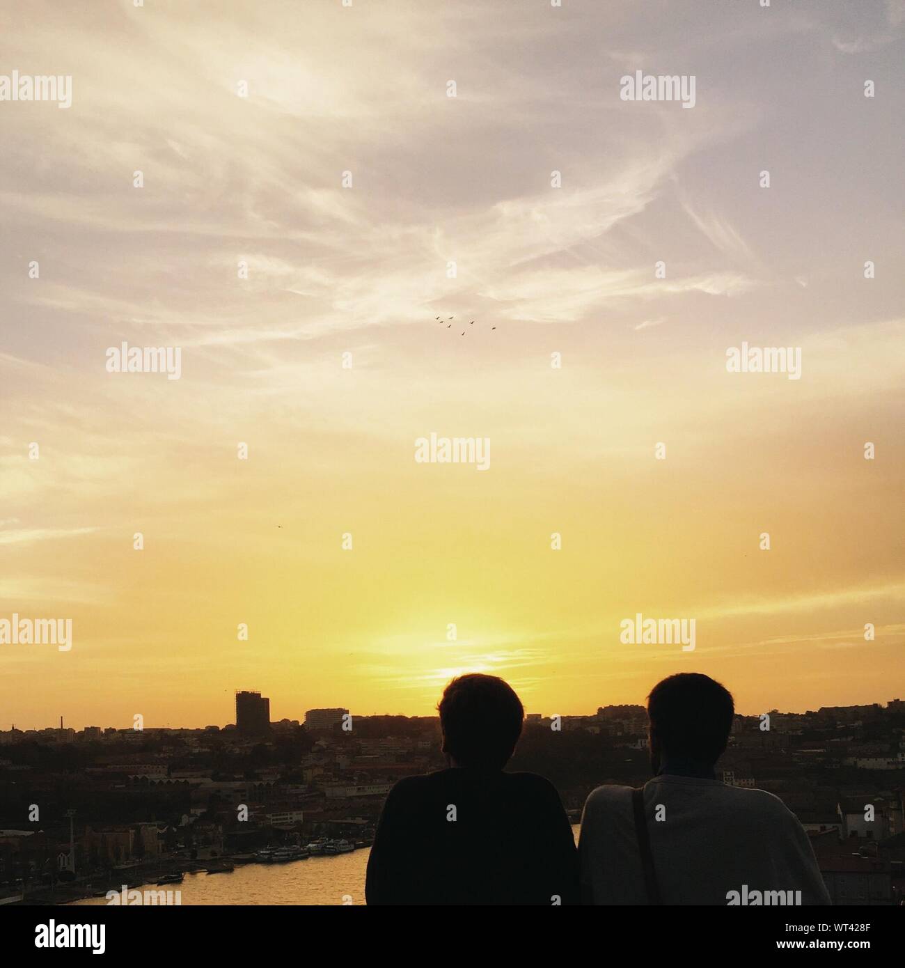 Two men watching sunset hi-res stock photography and images - Alamy