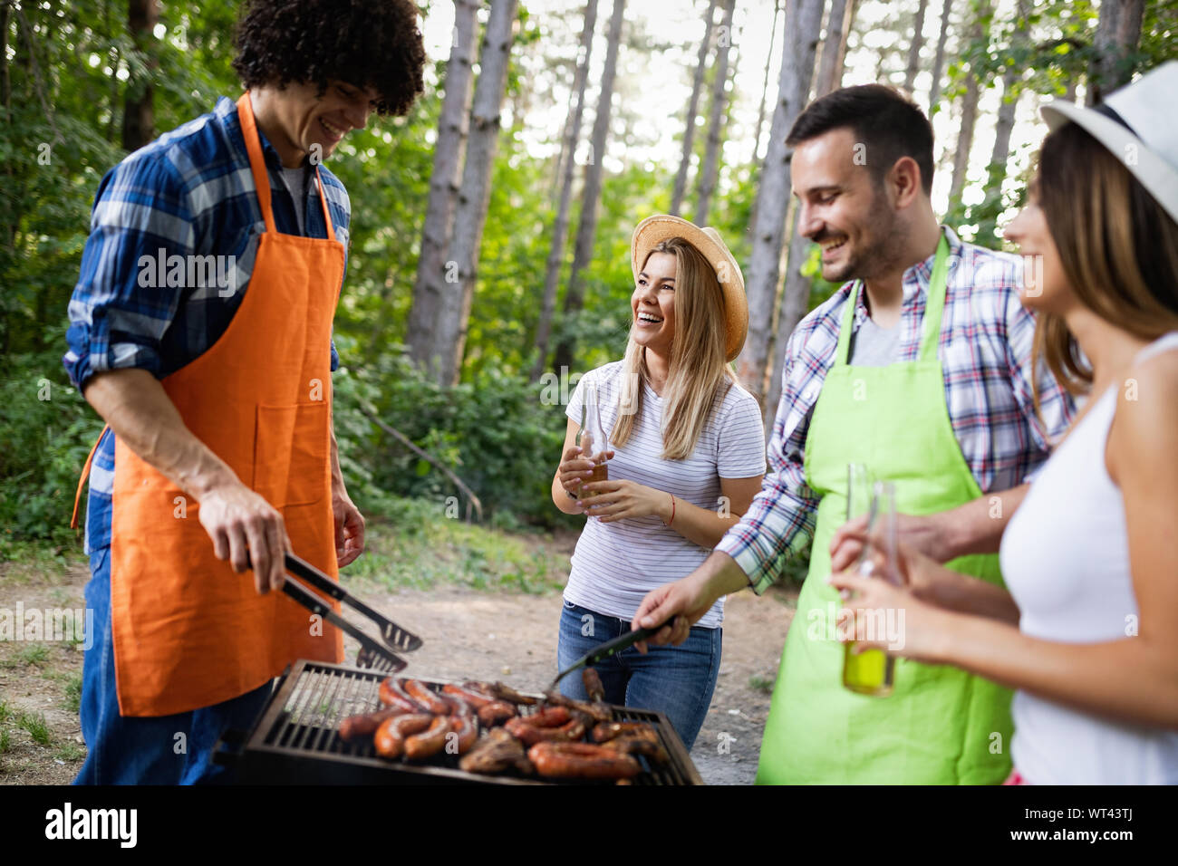 Group of friends having barbecue party in nature Stock Photo - Alamy