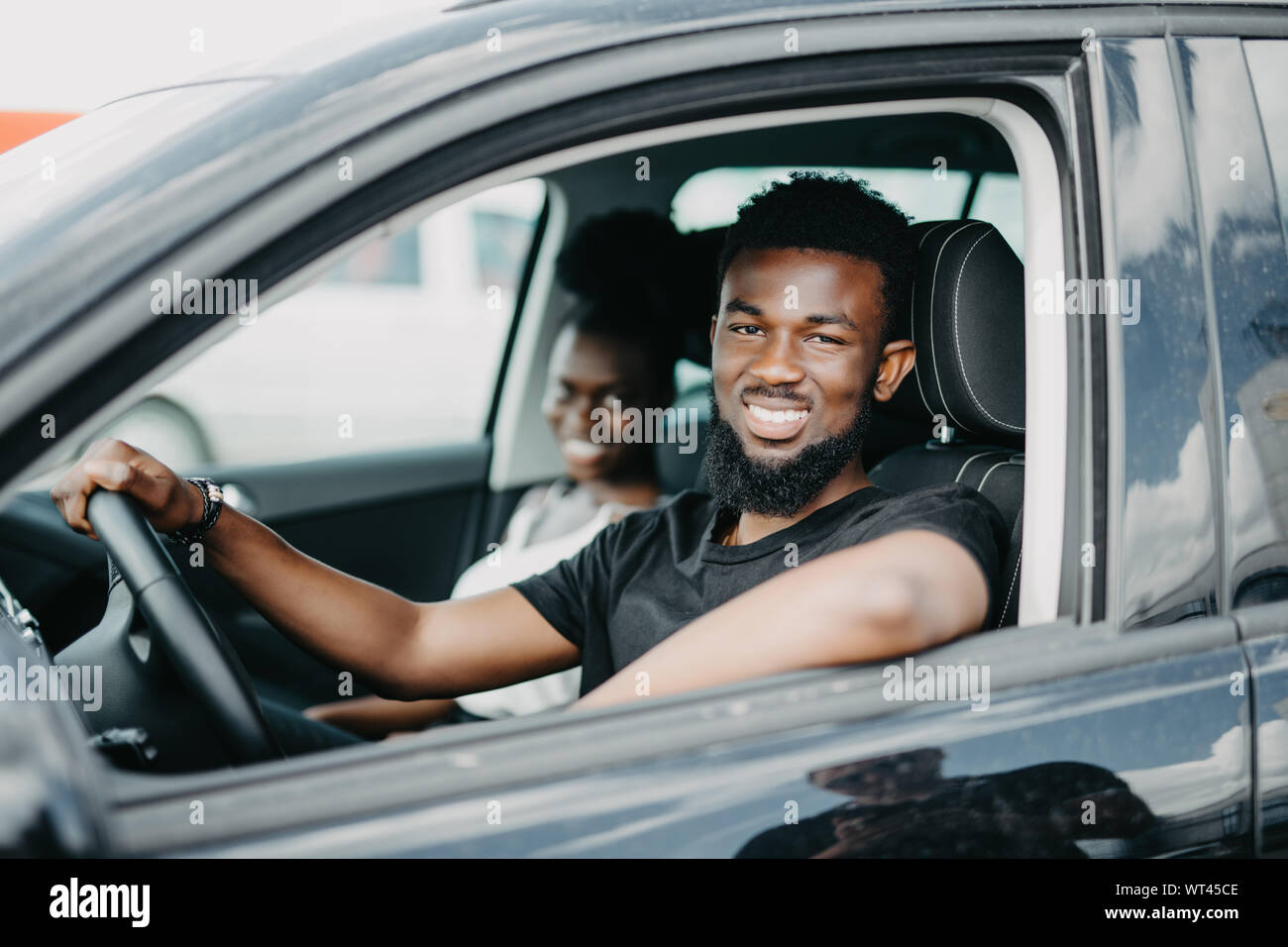 African couple driving convertible car hi-res stock photography and ...
