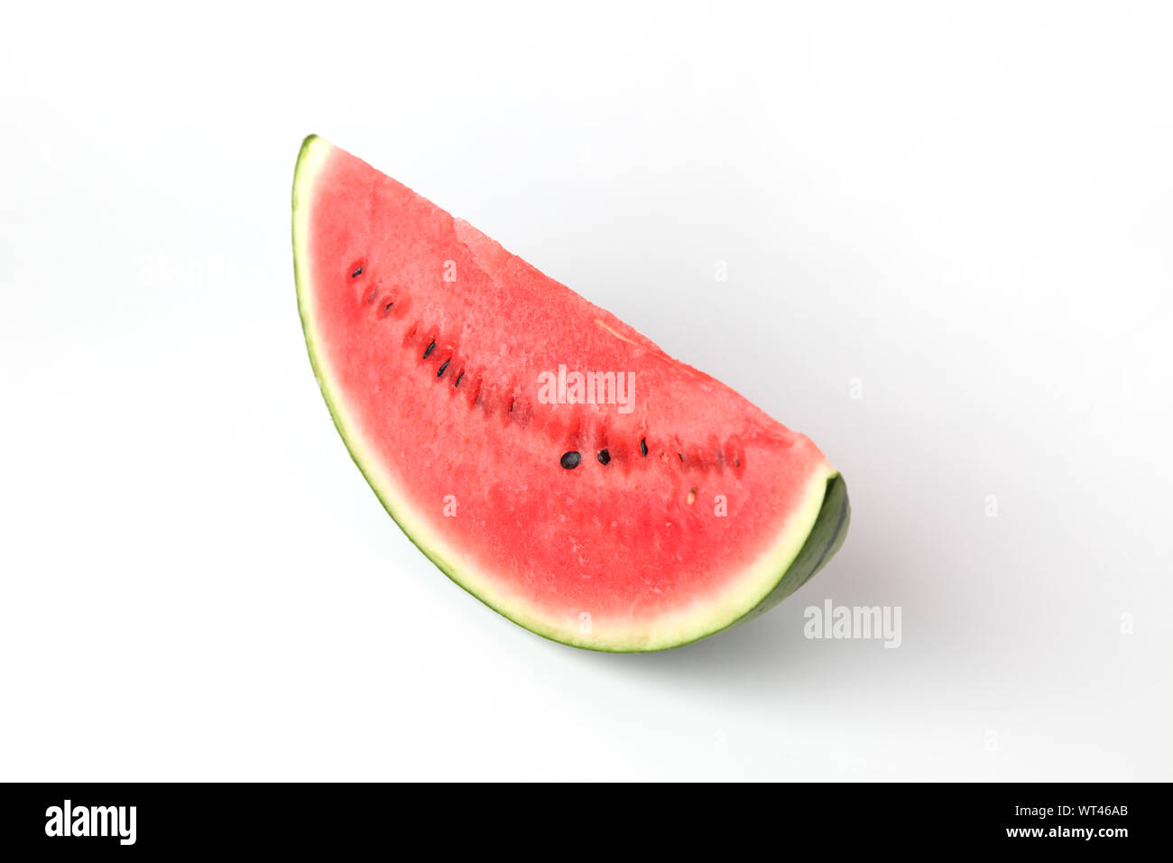 sliced watermelon closeup isolated on white background Stock Photo - Alamy