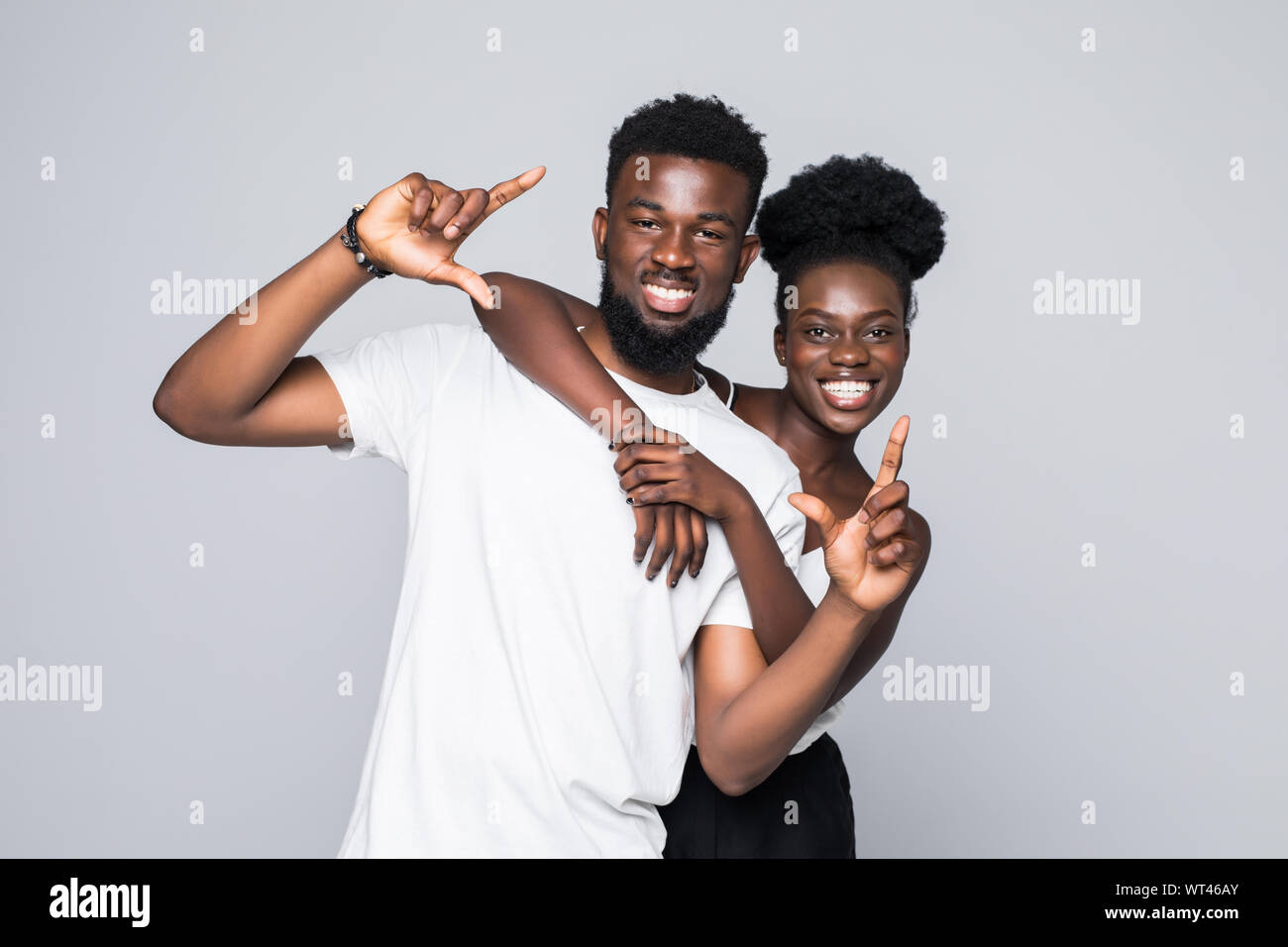 Young african couple hug isolated on white background Stock Photo - Alamy