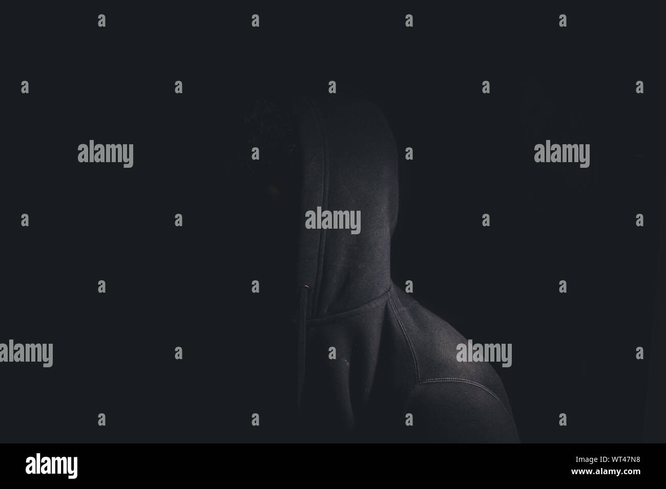 Person in darkness hi-res stock photography and images - Alamy